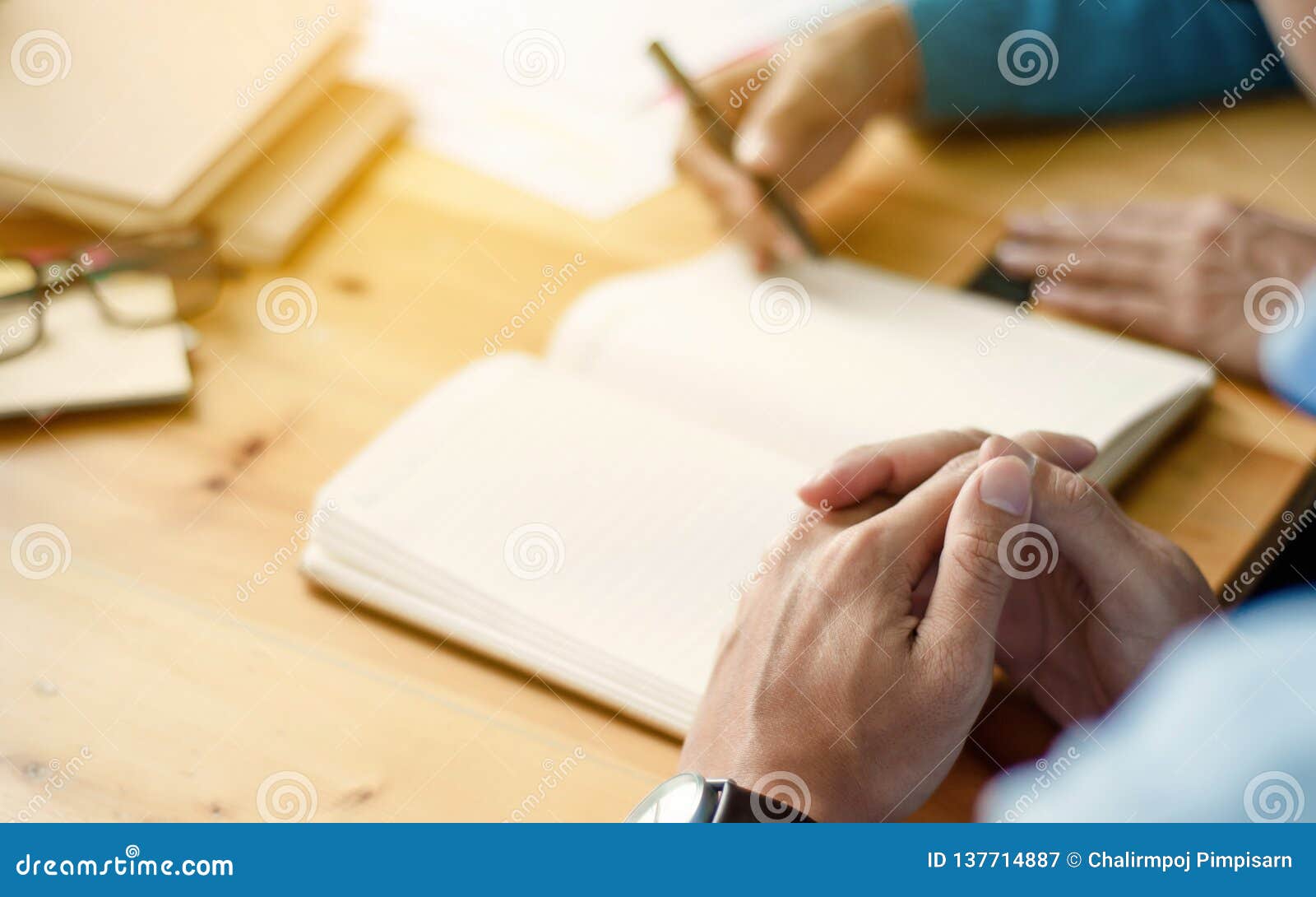 Two Confident Students Doing Homework Together While Sitting At The ...