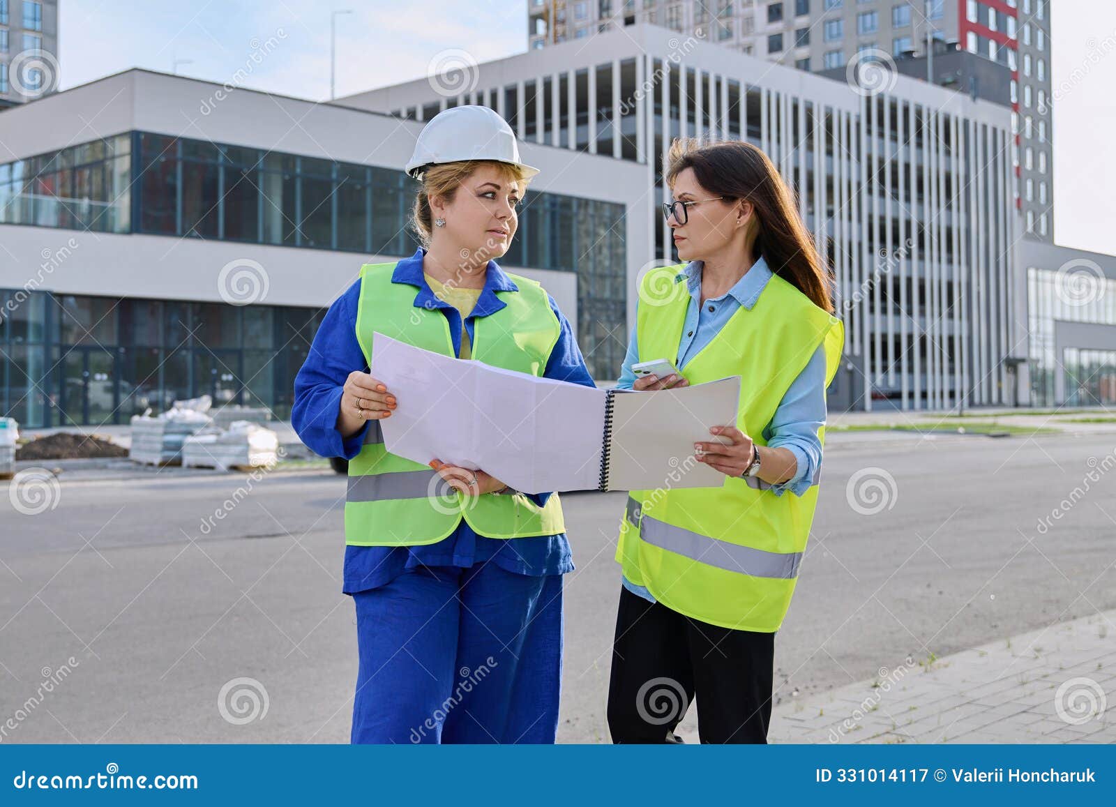 Two Confident Women Talking Working on Construction of Residential ...