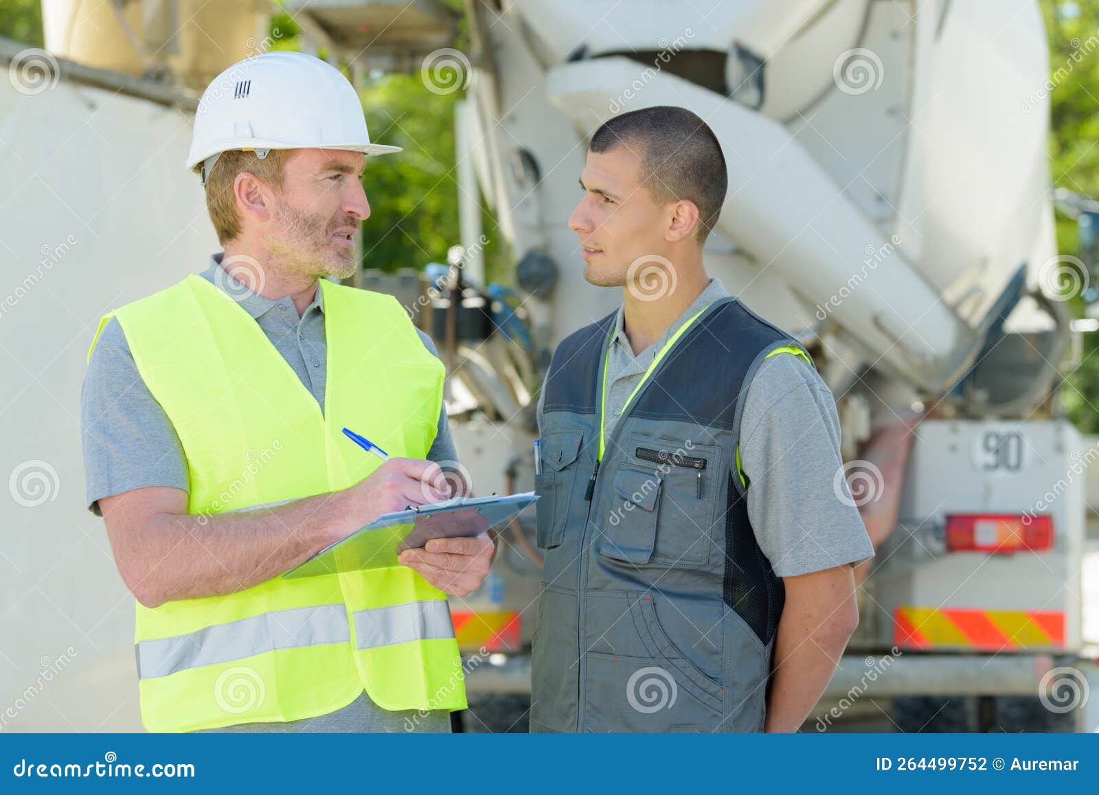 Two Construction Engineers Supervising Work at Building Site Stock ...