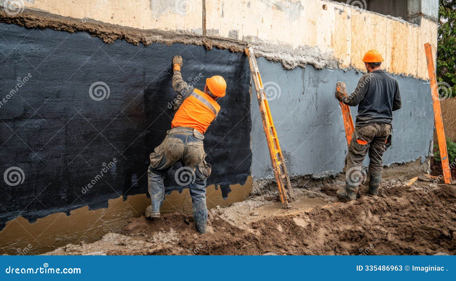 Two Construction Workers Applying Waterproofing Membrane To a ...