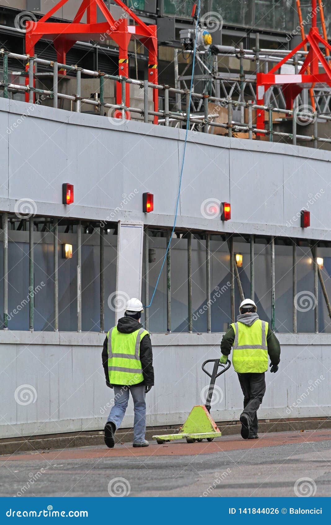 Two Construction Workers stock photo. Image of lights - 141844026