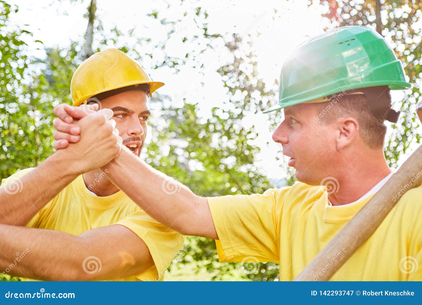 Two Construction Workers Congratulate Each Other during Construction ...