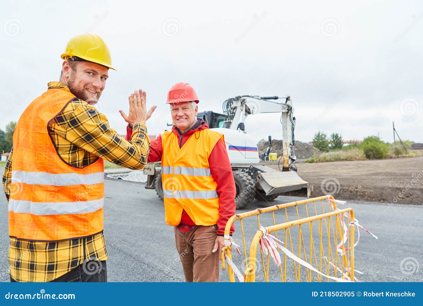 Two Construction Workers Greet Each Other with High Five Stock Image ...