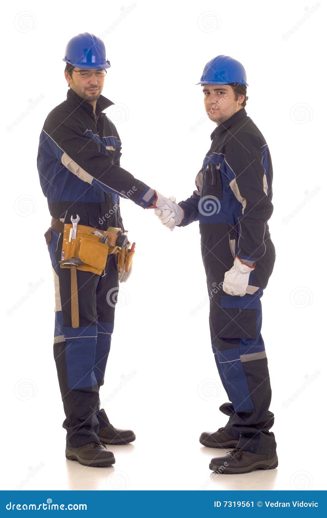 Two Construction Workers Handshake. Stock Image - Image of blueprint ...