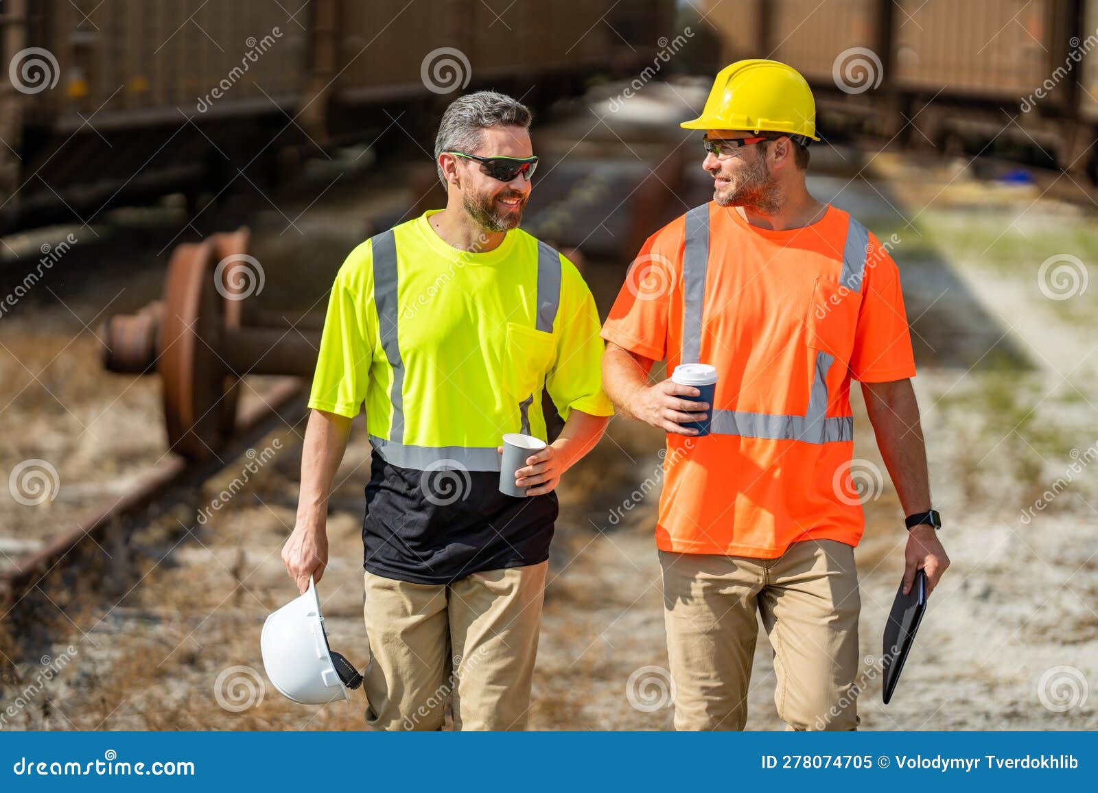 Two Construction Workers in Helmet at Building. Construction Building ...