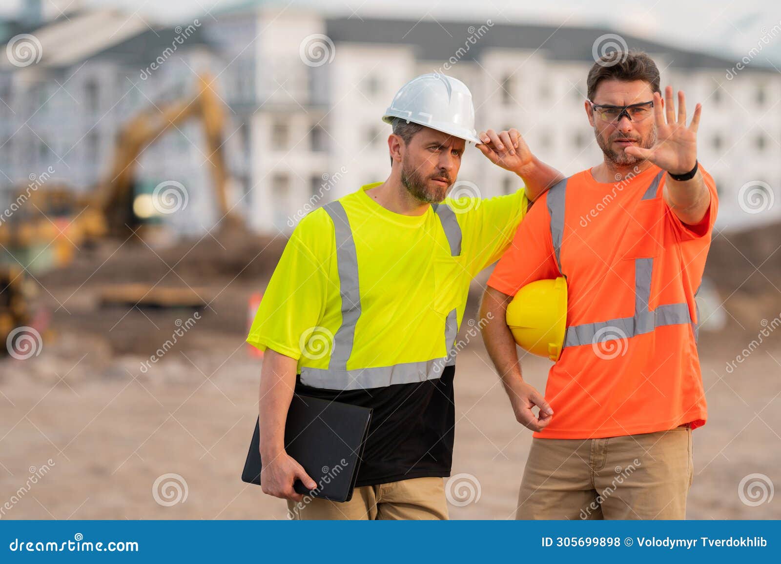 Two Construction Workers in Helmet at Building. Construction Building ...