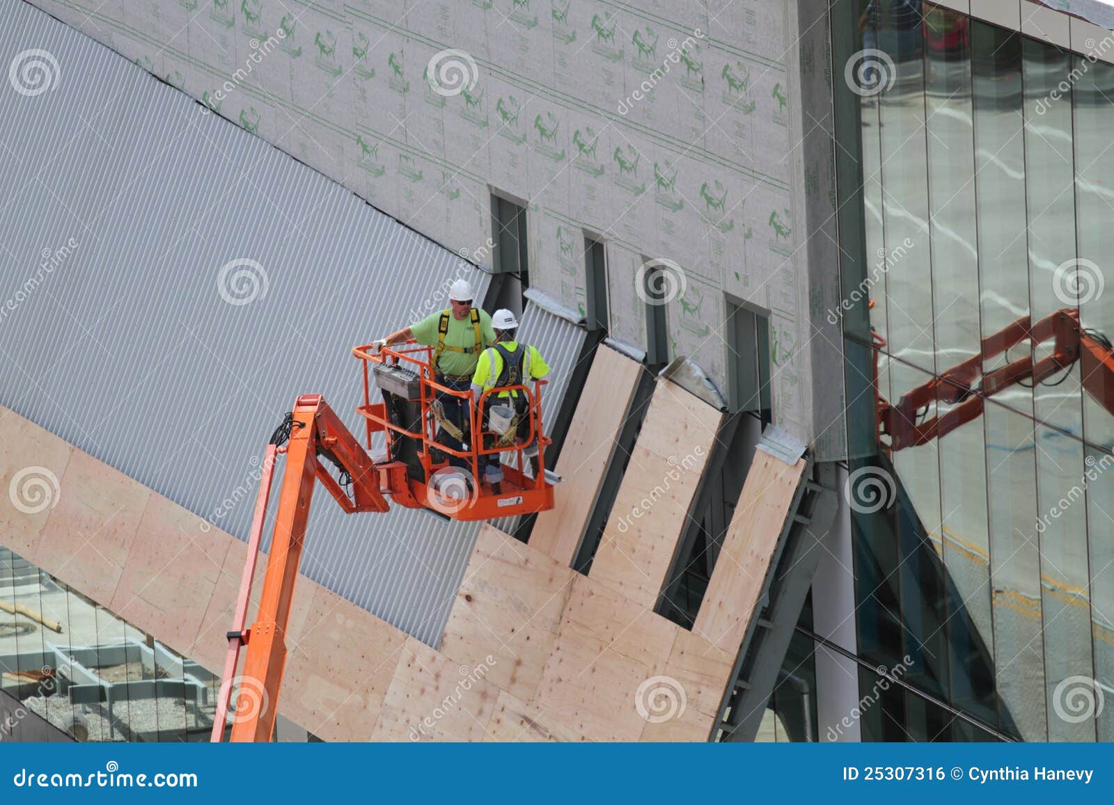 Two Construction Workers on Lift with Safety Vests Editorial Photo ...