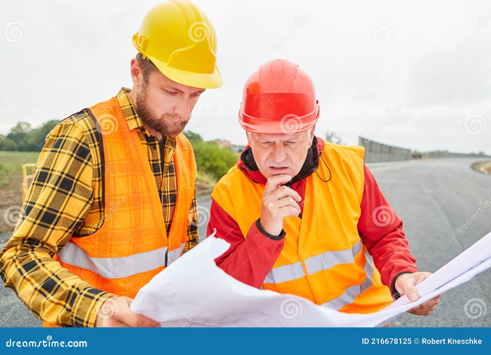 Two Construction Workers Look at a Floor Plan Stock Image - Image of ...