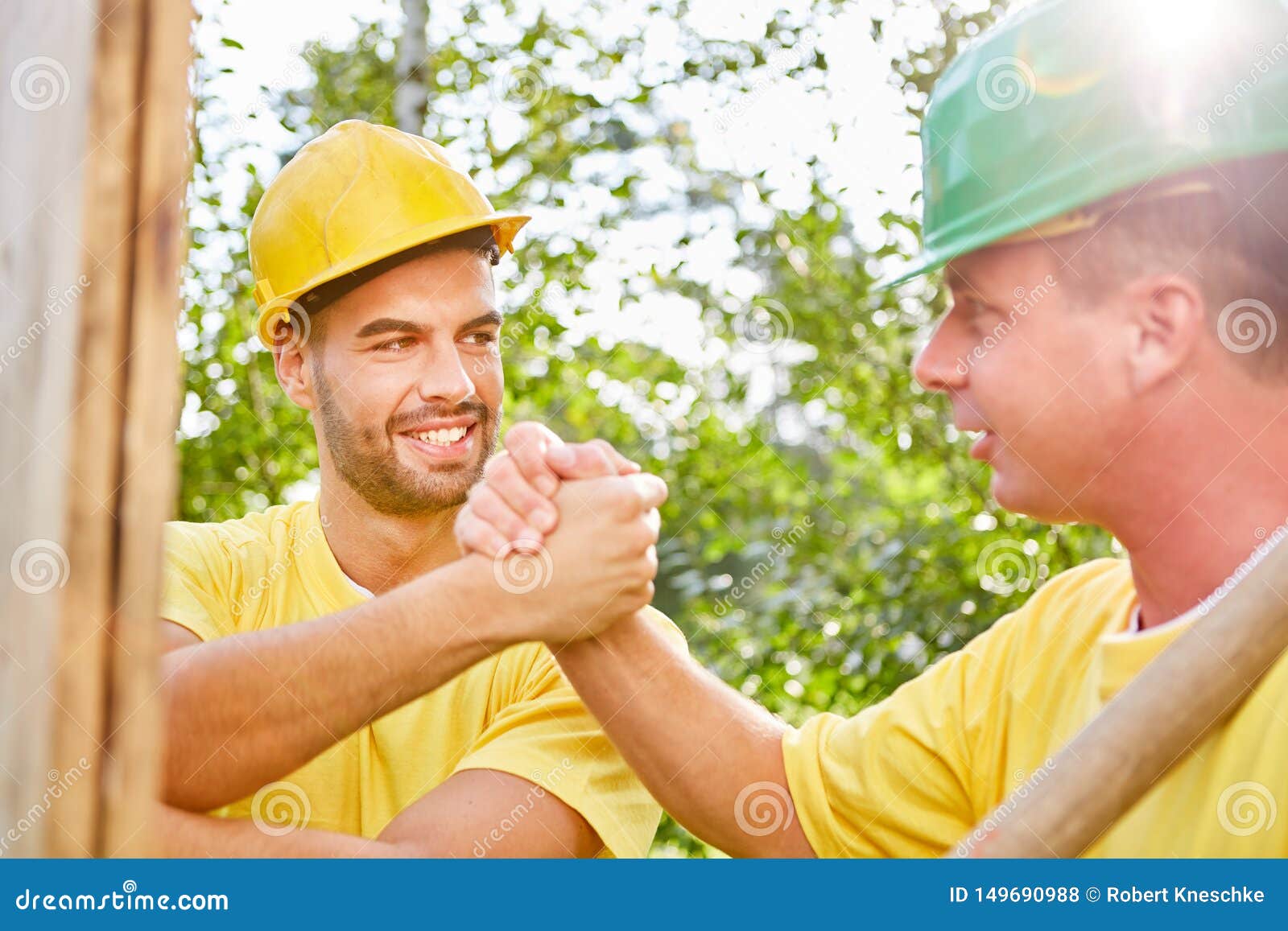 Two Construction Workers Shake Hands Stock Photo - Image of solidarity ...