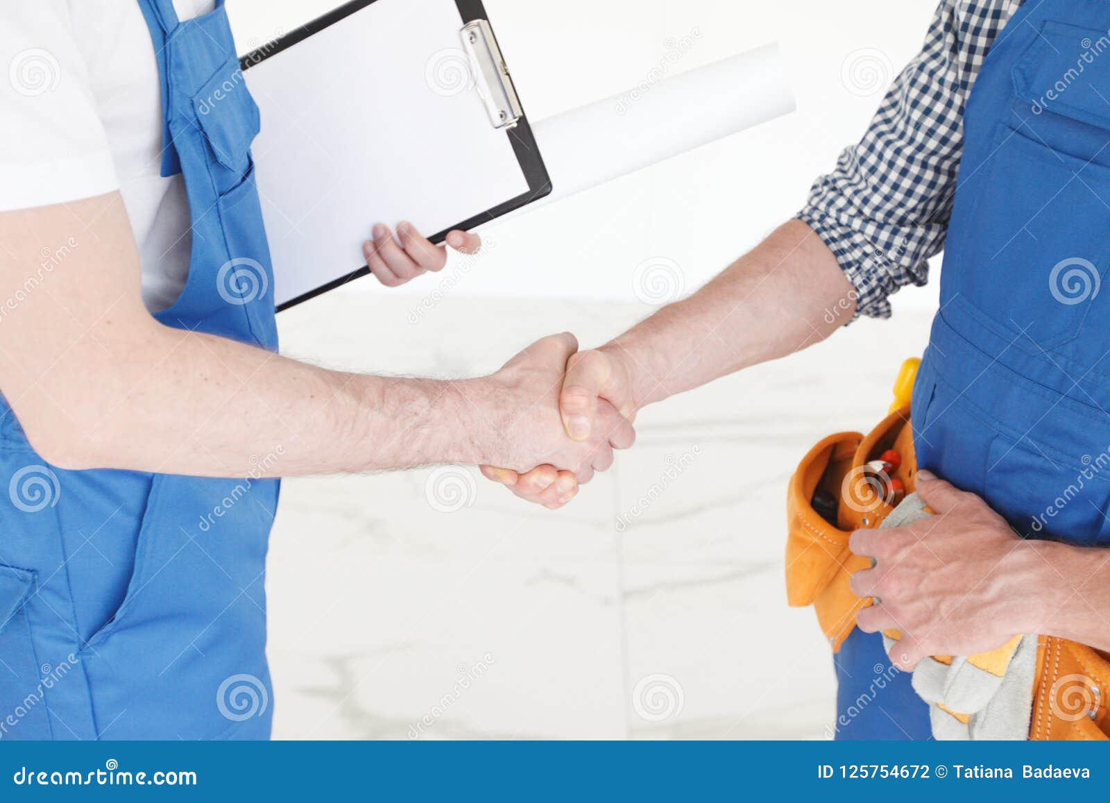 Two Construction Workers Shaking Hands Stock Photo - Image of partner ...