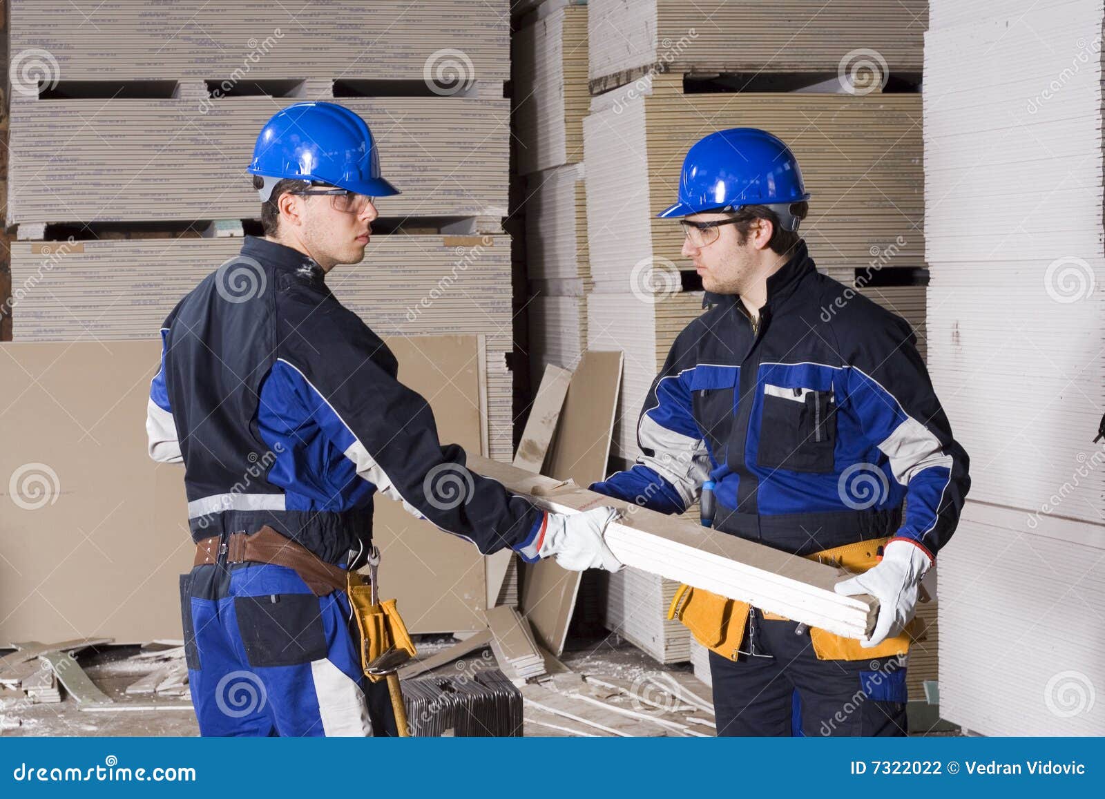 Two Construction Workers Teamwork Stock Photo - Image of document ...