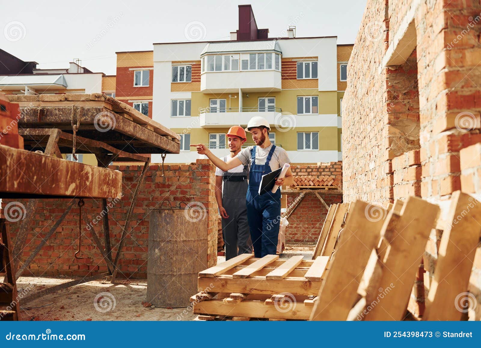 Two Construction Workers is Together at the Building Stock Image ...