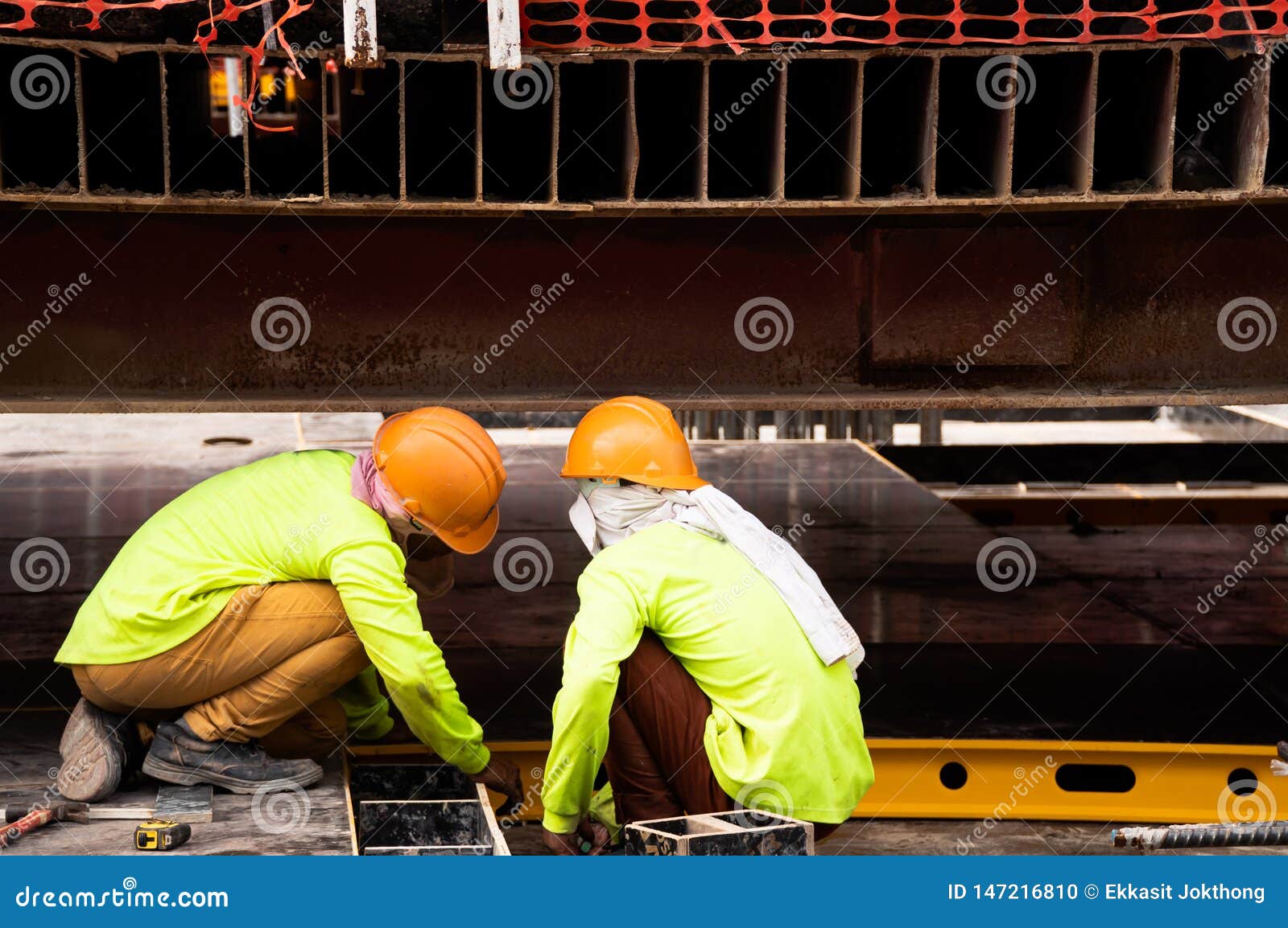Two Construction Workers Wearing Green Safety Shirt Sitting and ...