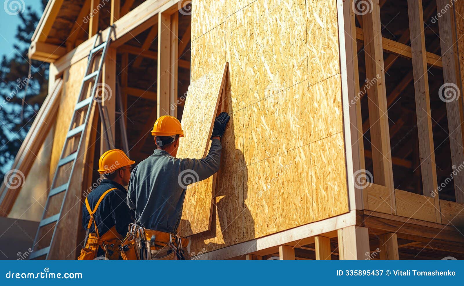 Two Construction Workers Wearing Safety Gear, Including Hard Hats and ...