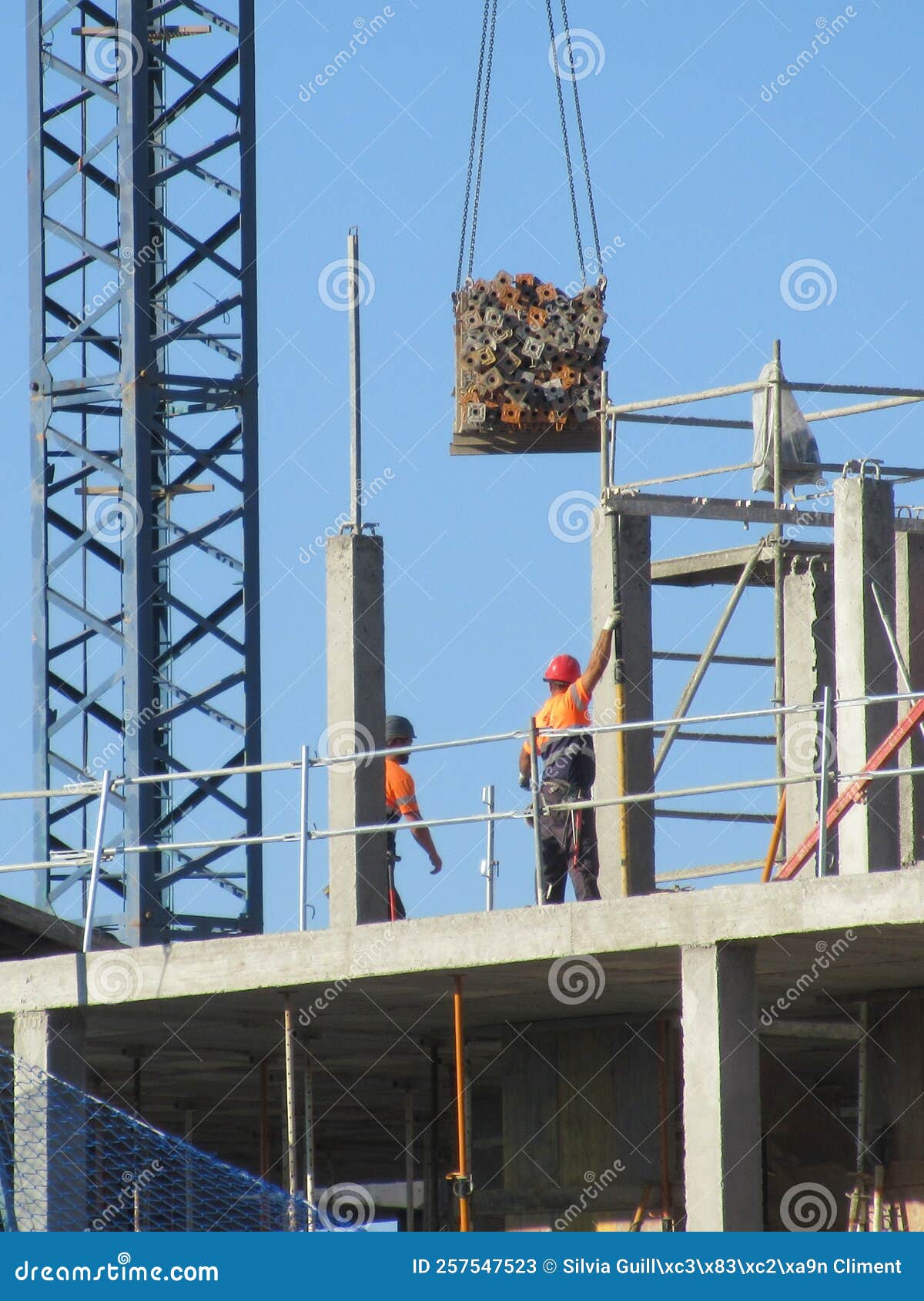 Two Construction Workers Working on a Construction Site. Bricklayer ...