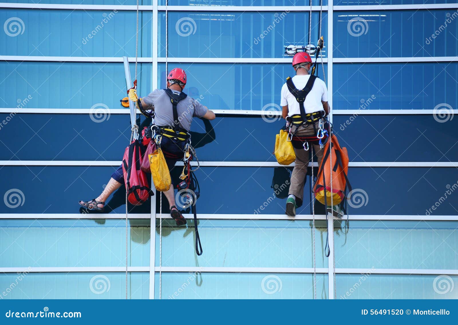 Two Construction Workers Working at Height on Skyscraper Stock Photo ...