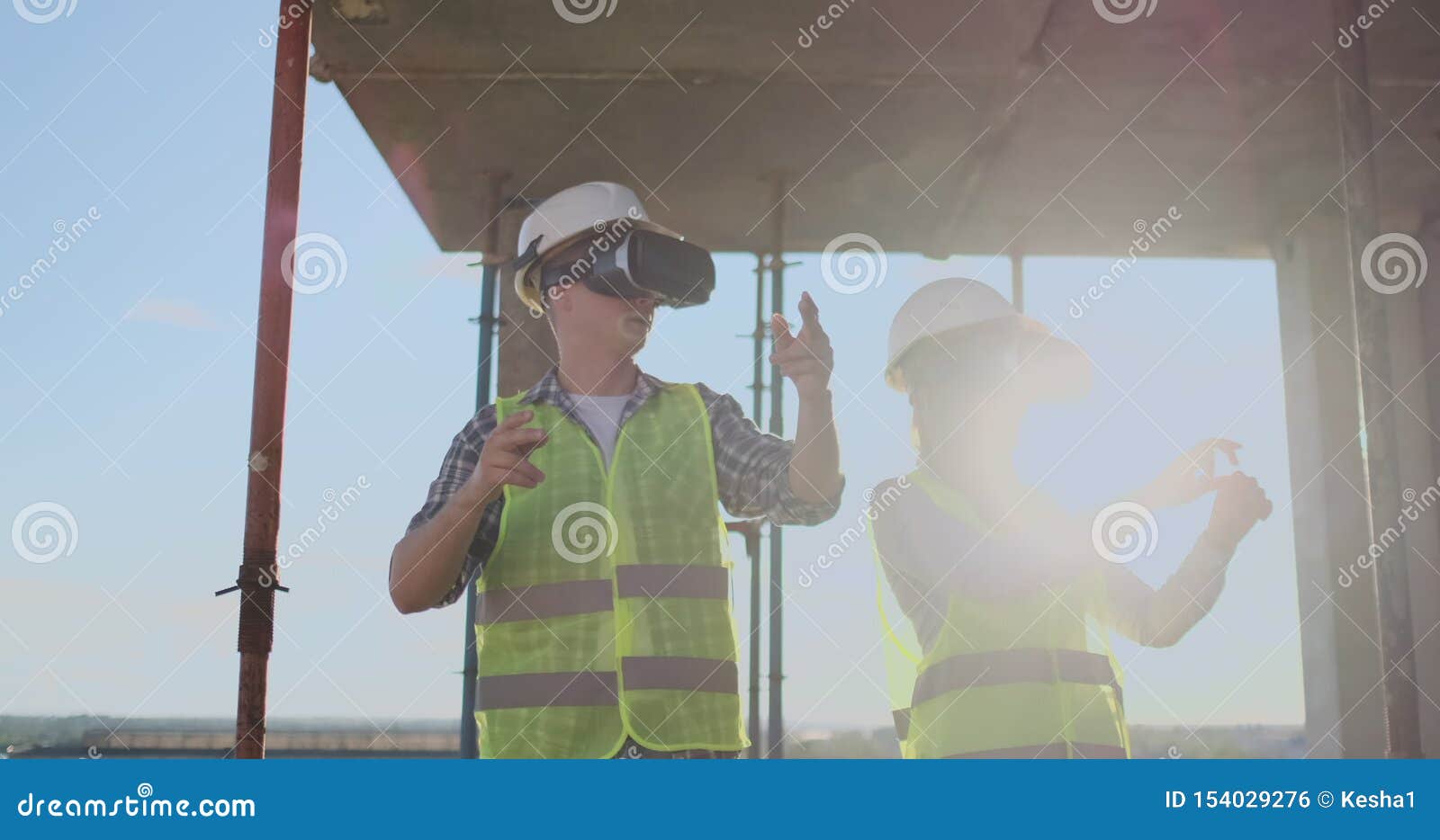 Two Contemporary Crew Workers Using VR To Visualize Projects Standing ...