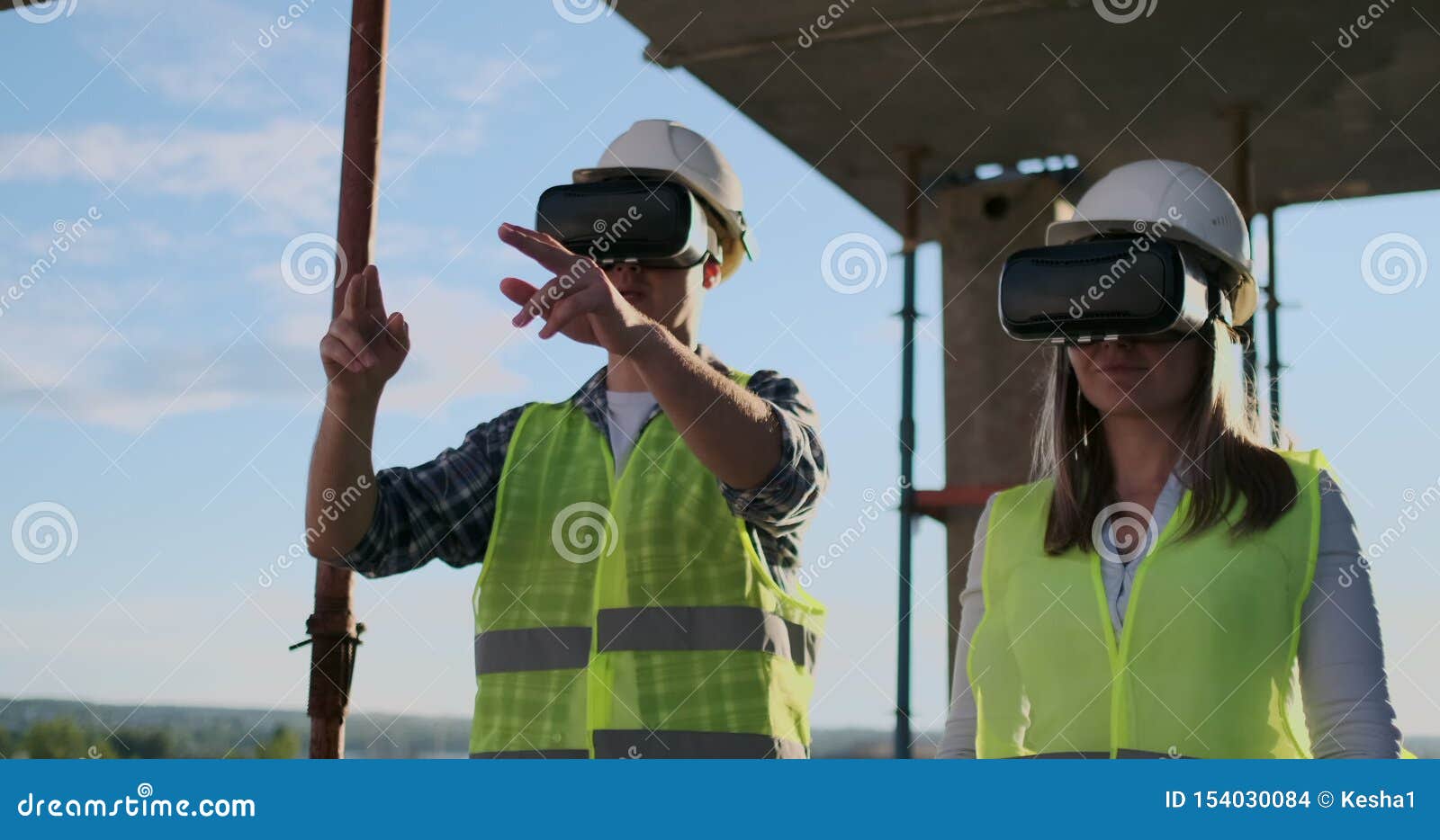 Two Contemporary Crew Workers Using VR To Visualize Projects Standing ...