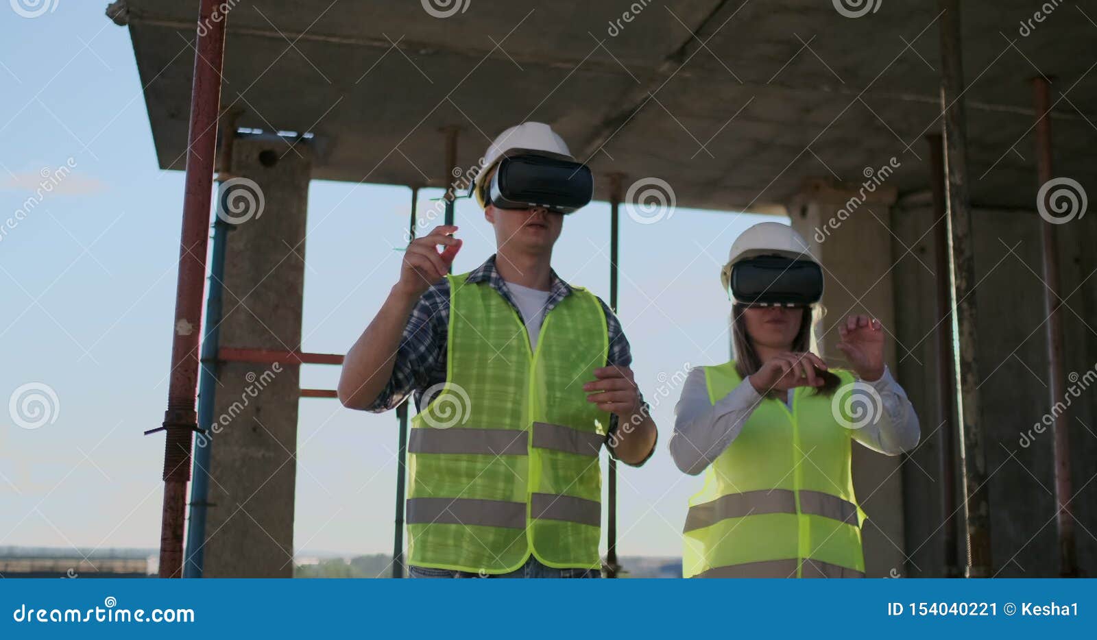 Two Contemporary Crew Workers Using VR To Visualize Projects Standing ...