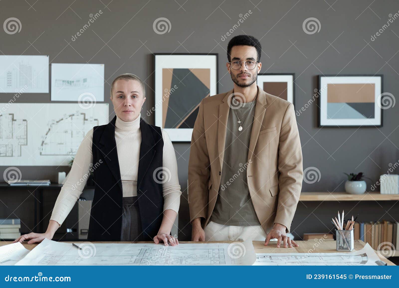 Two Contemporary Engineers Standing by Table with Sketch Stock Image ...