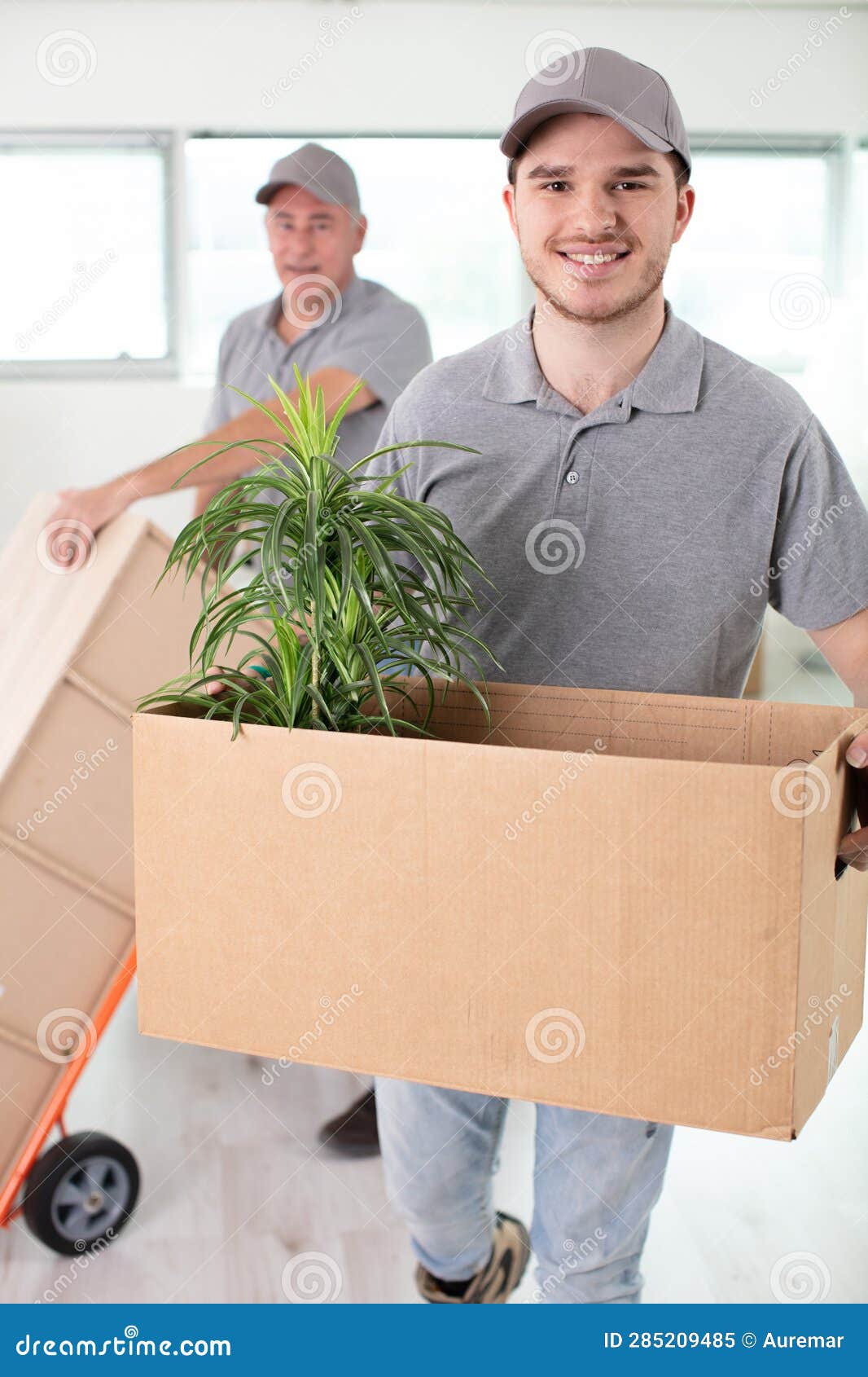 Two Contractor Employees Moving Personal Belongings Stock Image - Image ...