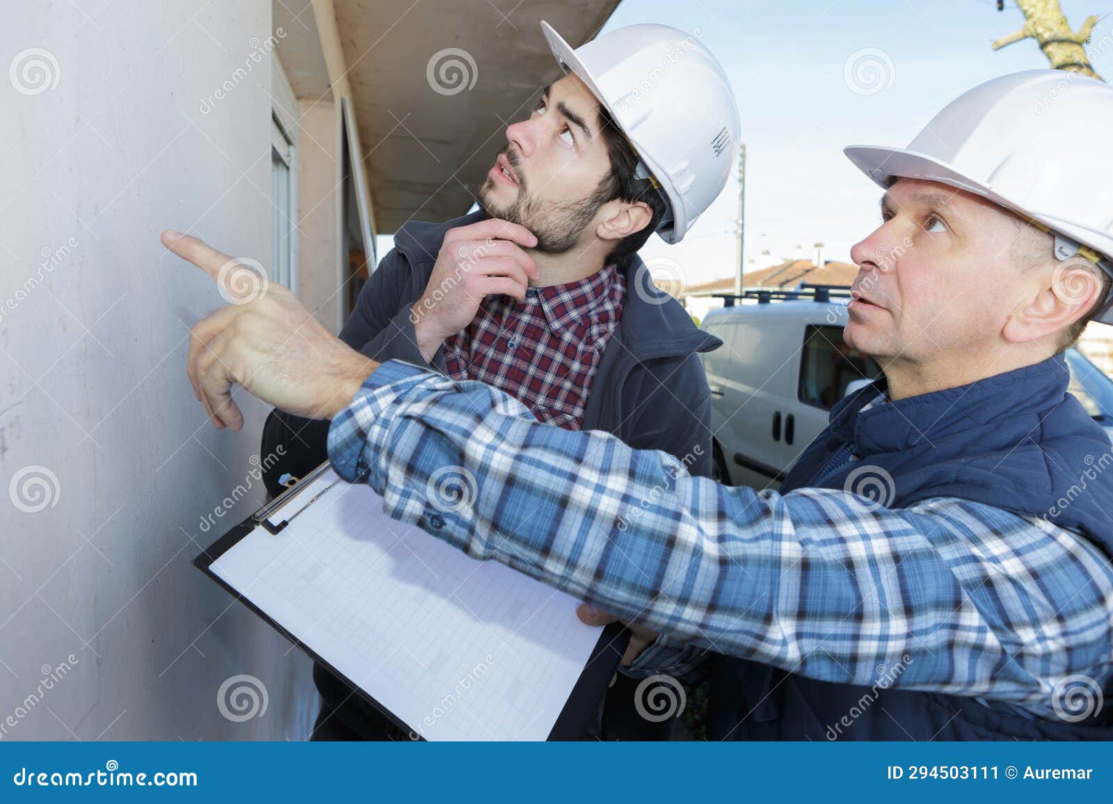 Two Contractors with Clipboard Assessing Exterior Wall Stock Image ...
