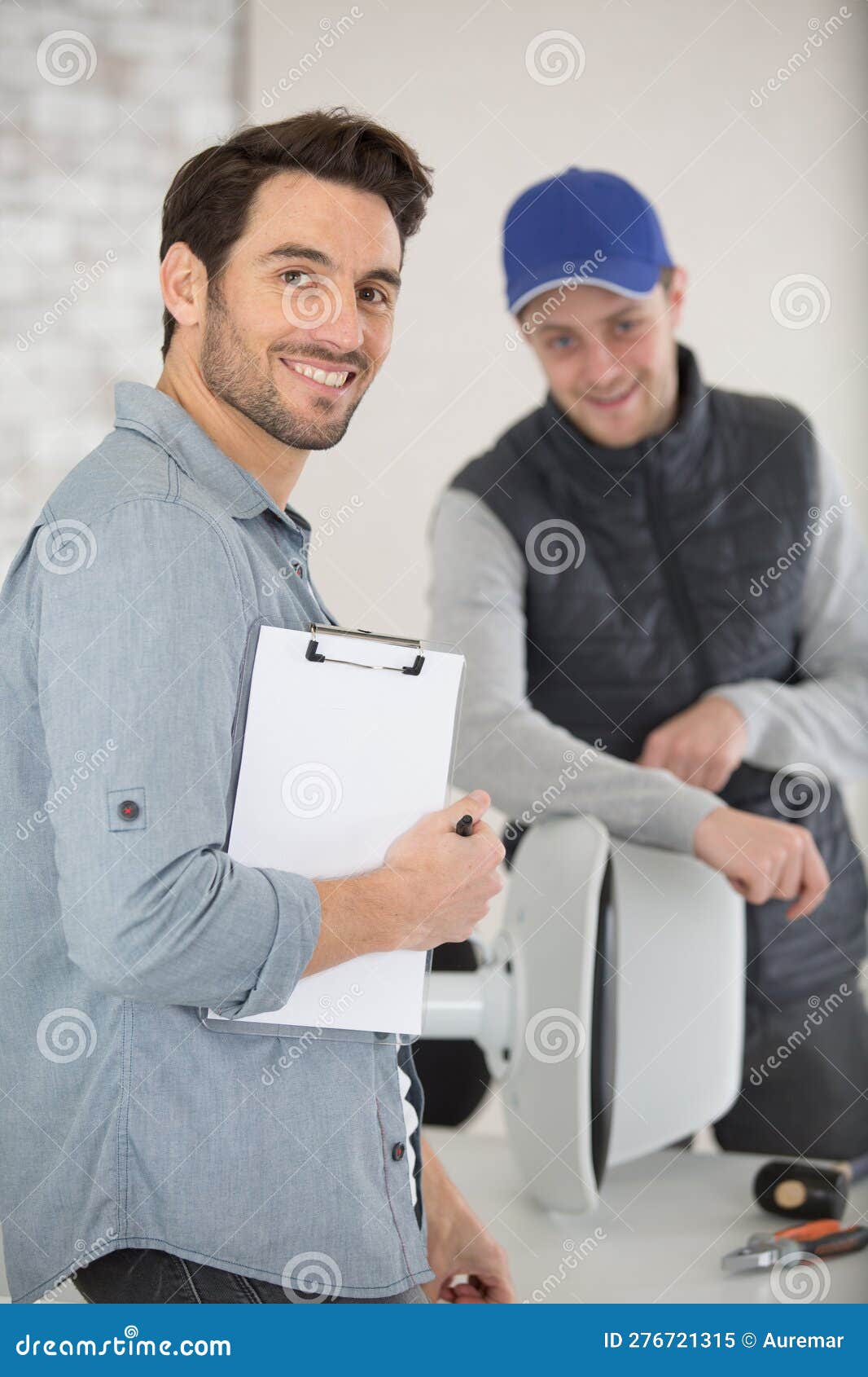 Two Contractors Working on Chair Indoors Stock Image - Image of fixing ...