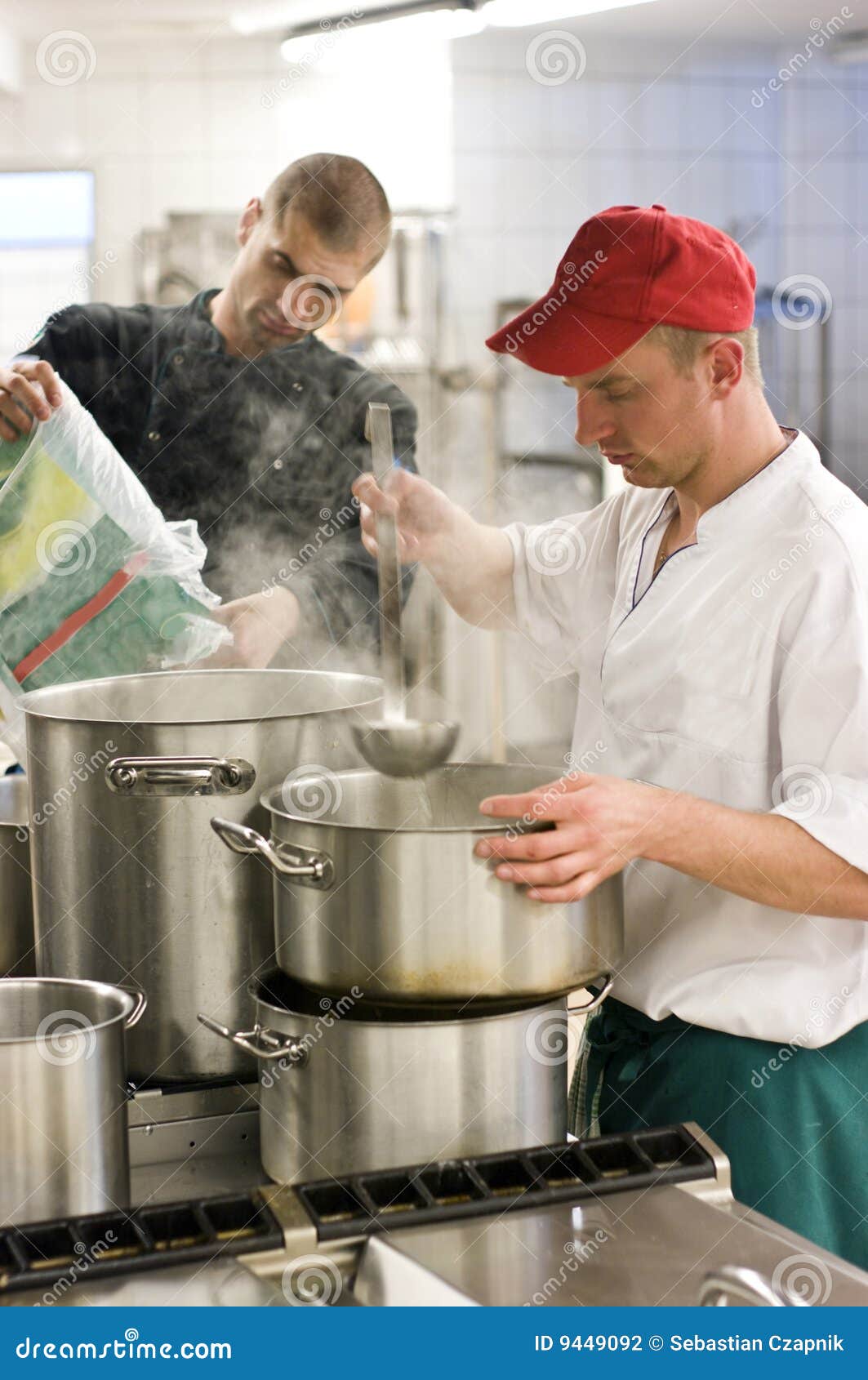 Two Cooks Industrial Kitchen Stock Photo - Image of people, mass: 9449092