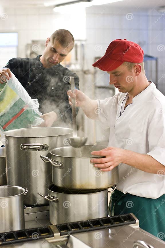 Two Cooks Industrial Kitchen Stock Photo - Image of people, mass: 9449092