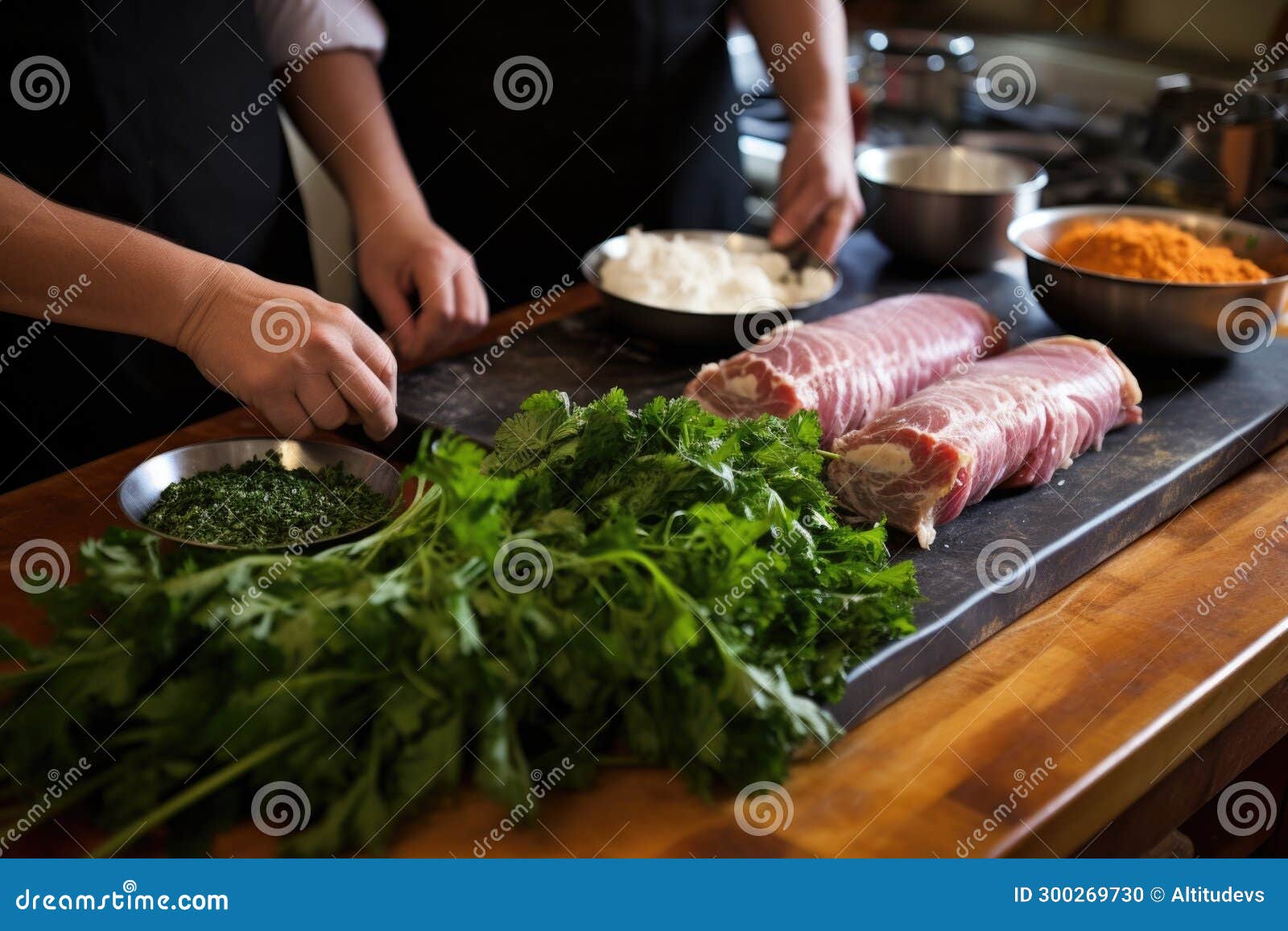 Two Cooks Preparing Herb-crusted Pork Stock Photo - Image of cooks ...