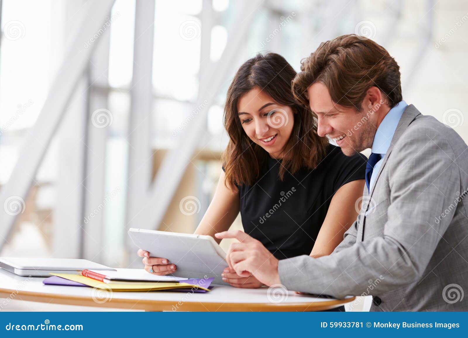 Two Corporate Business Colleagues Working Together in Office Stock ...