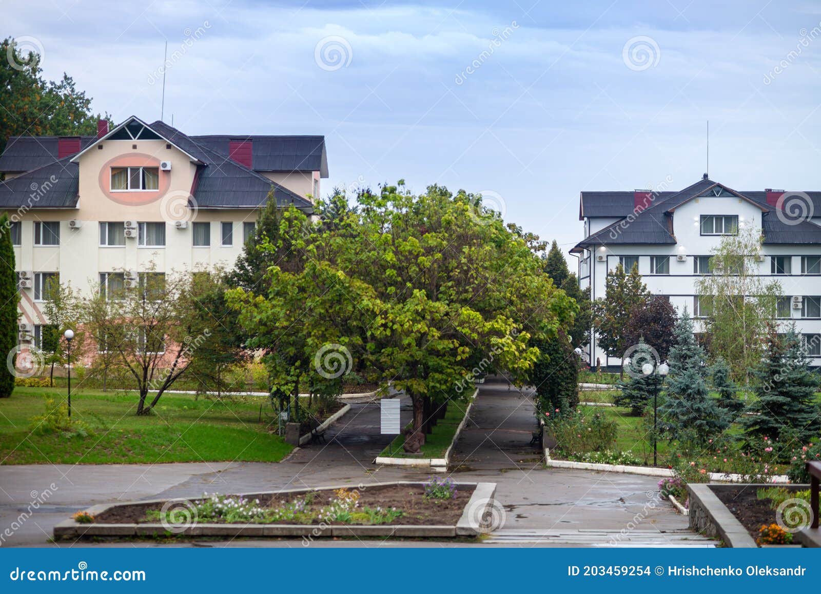 Two Cottages and an Alley on the Territory Stock Photo - Image of ...