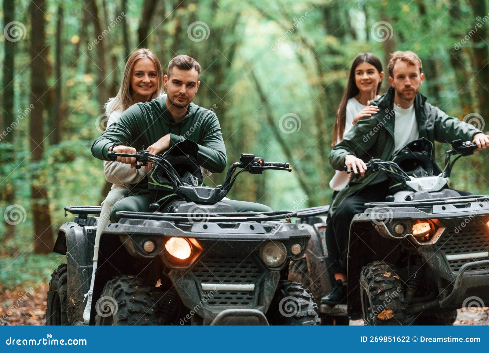 Two Couples on a Quad Bike in the Forest during the Day Stock Photo ...