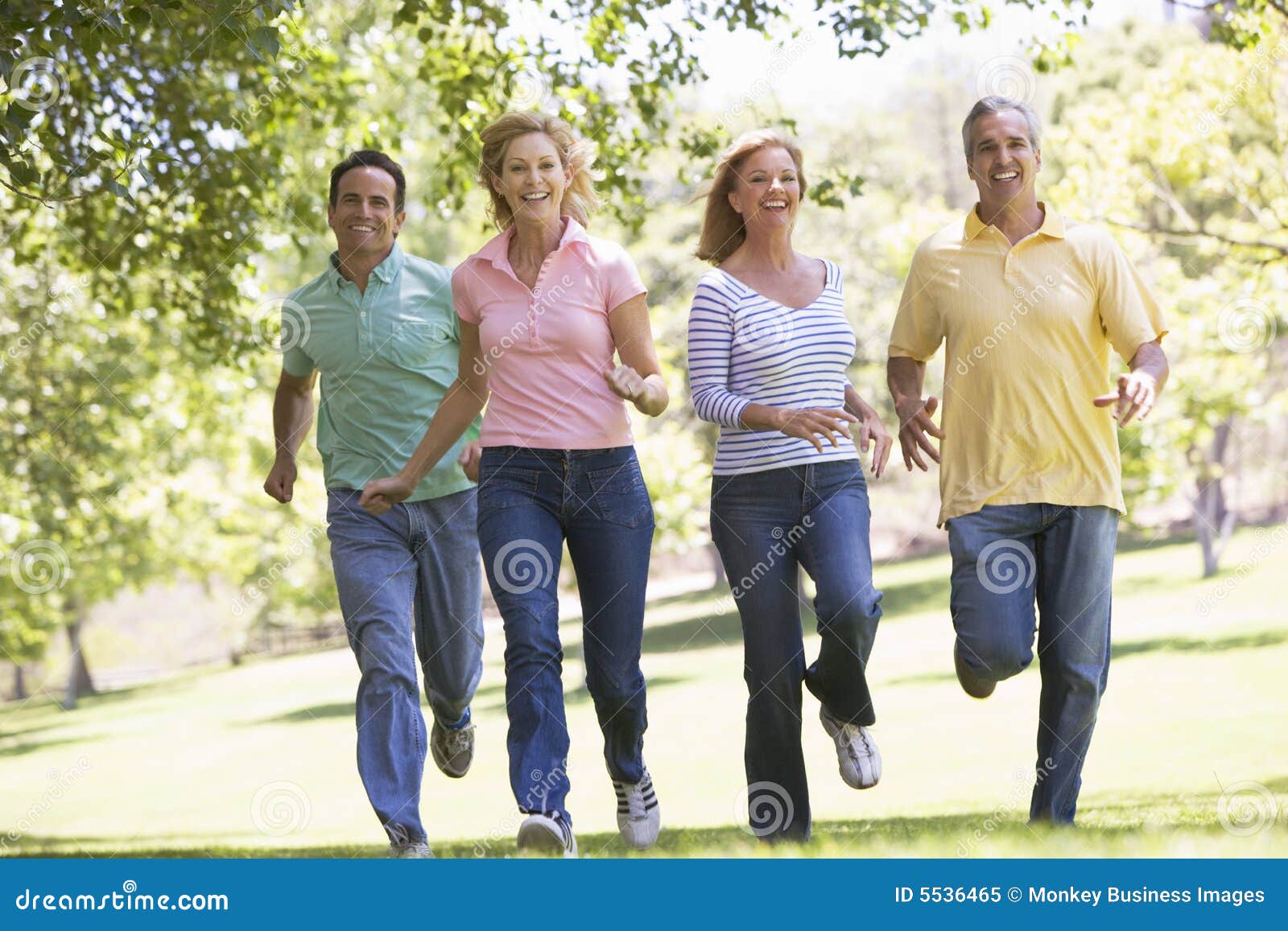Two Couples Running Outdoors Smiling Stock Image - Image of life ...