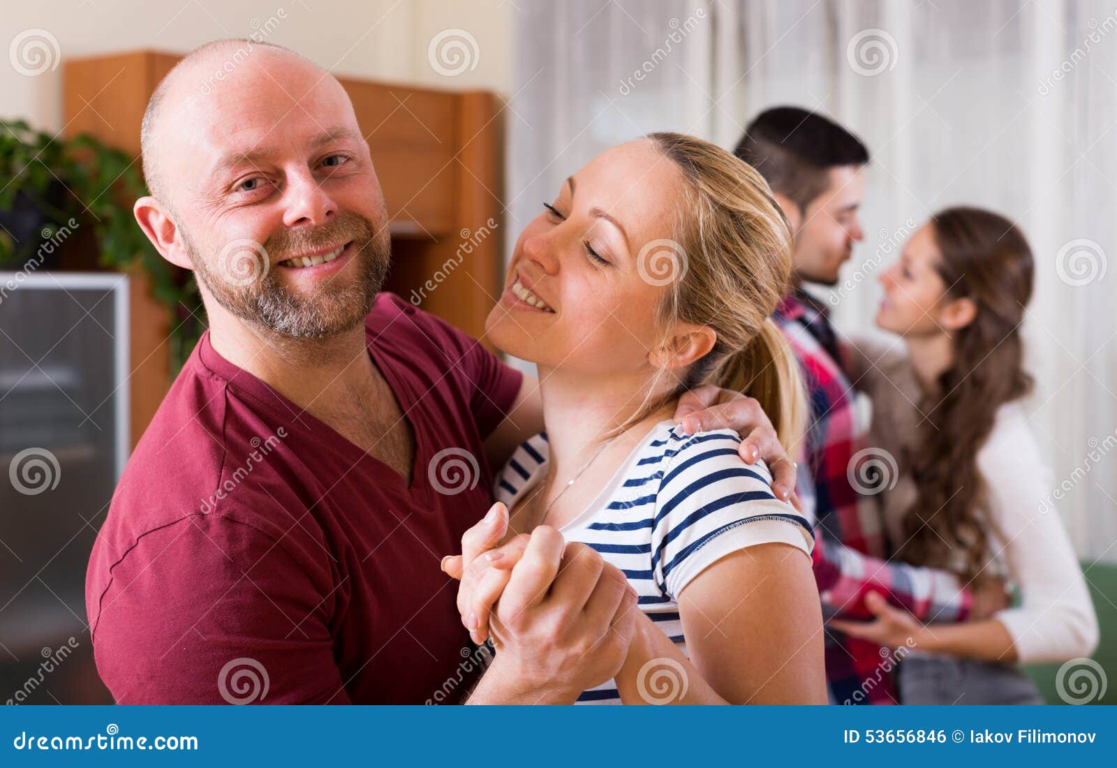 Two Couples Smiling and Moving in Slow Dance Stock Photo - Image of ...