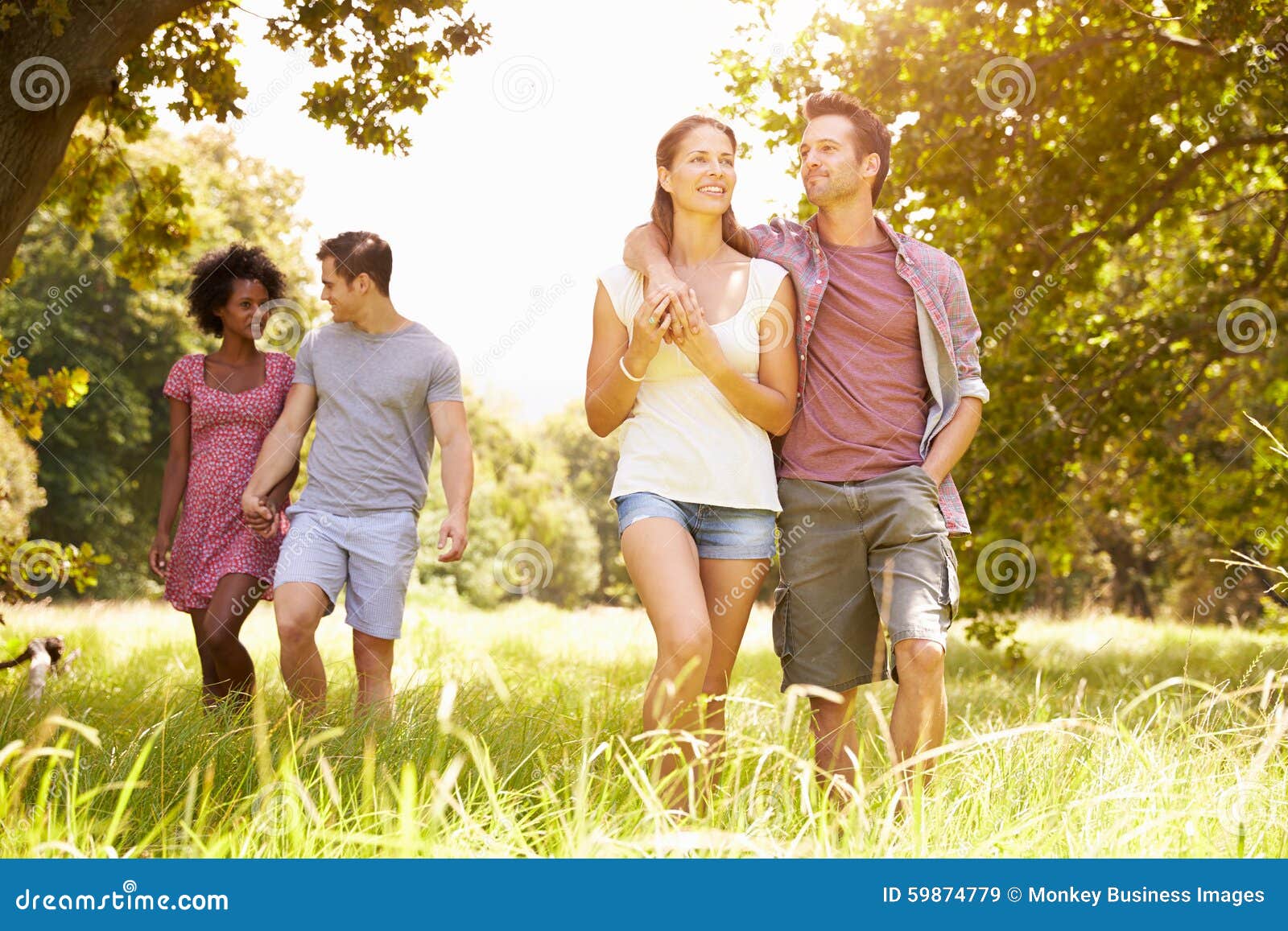 Two Couples Walking Together in the Countryside Stock Image - Image of ...