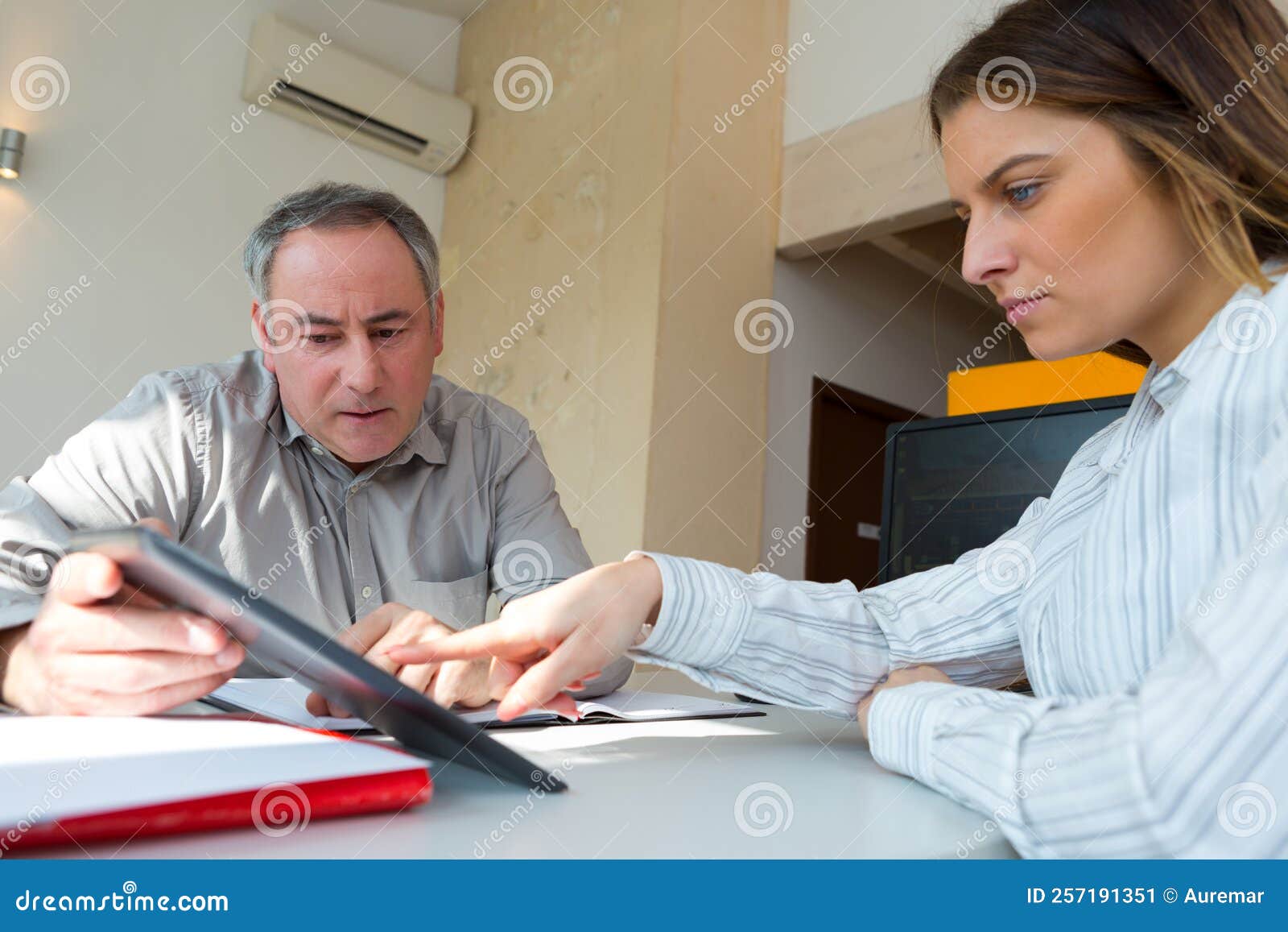 Two coworkers in office stock image. Image of cooperation - 257191351