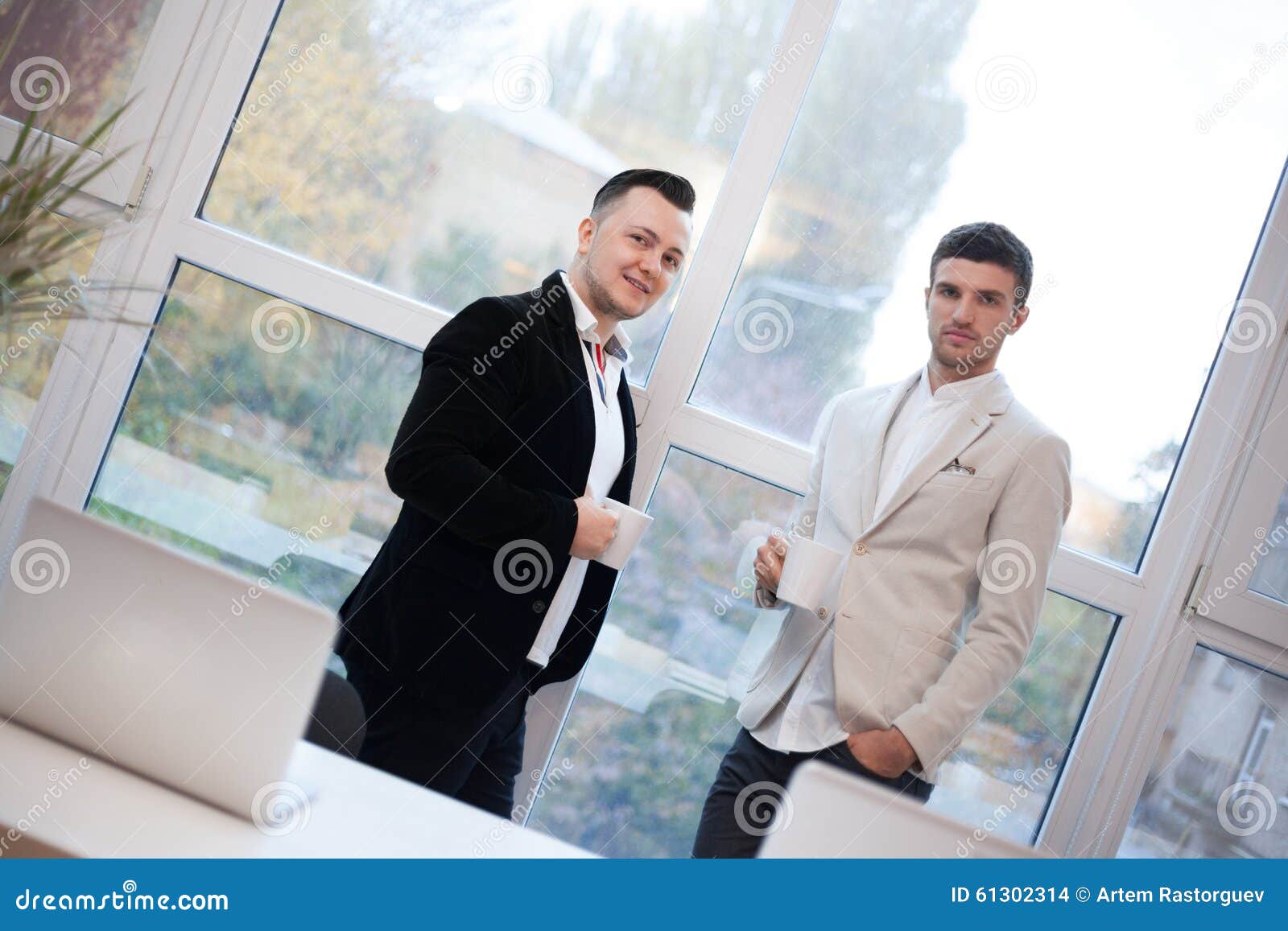 Two coworkers talking stock photo. Image of coworker - 61302314