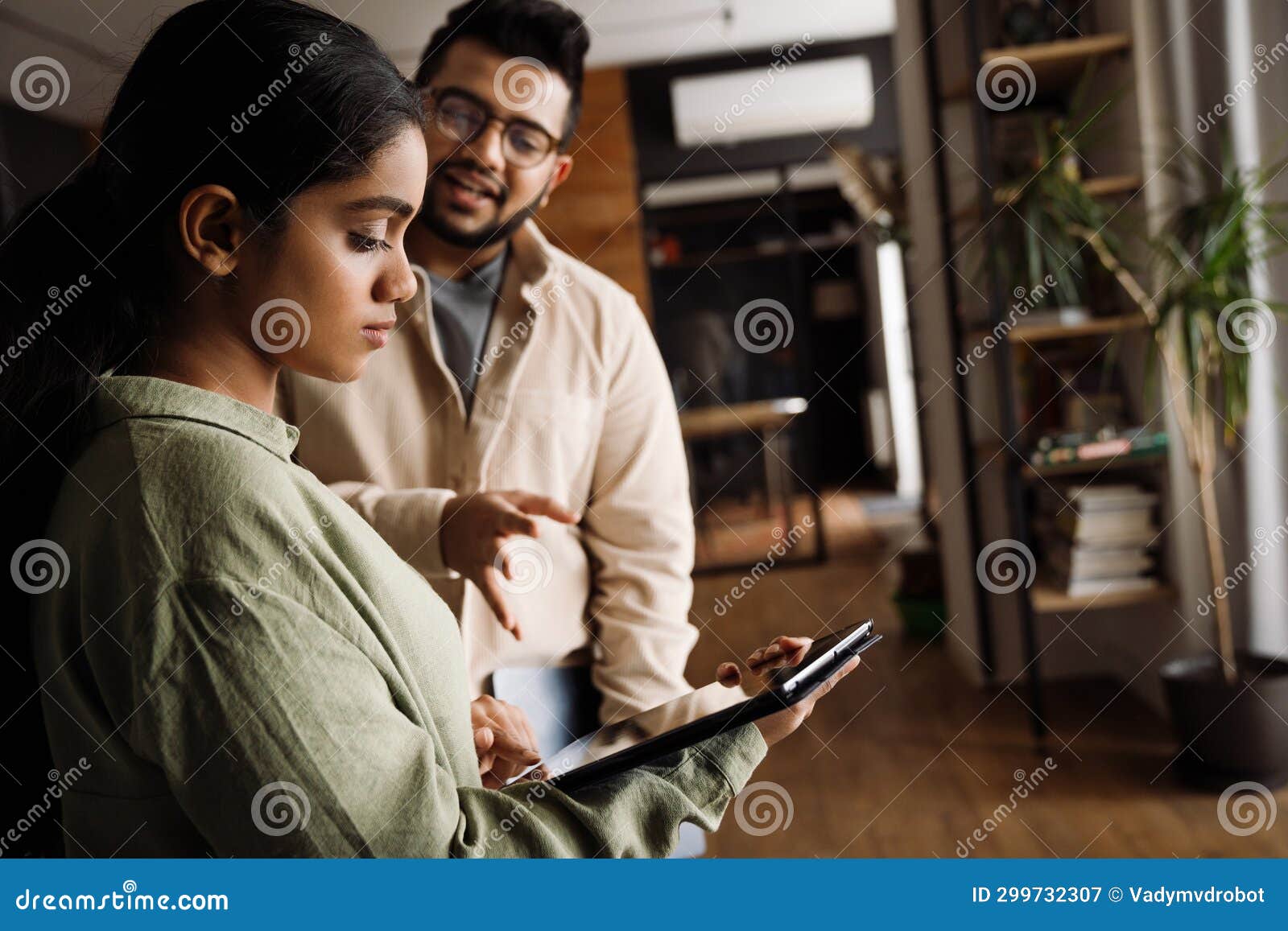 Two Coworkers Using Tablet while Working Together in Office Stock Image ...
