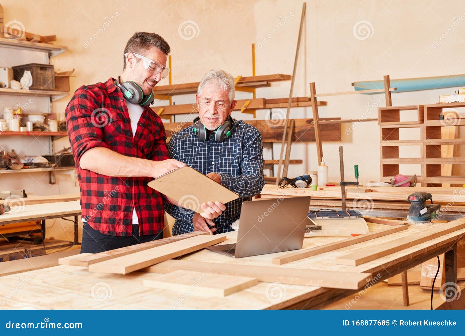 Two Craftsmen with Checklist and Laptop Stock Image - Image of ...