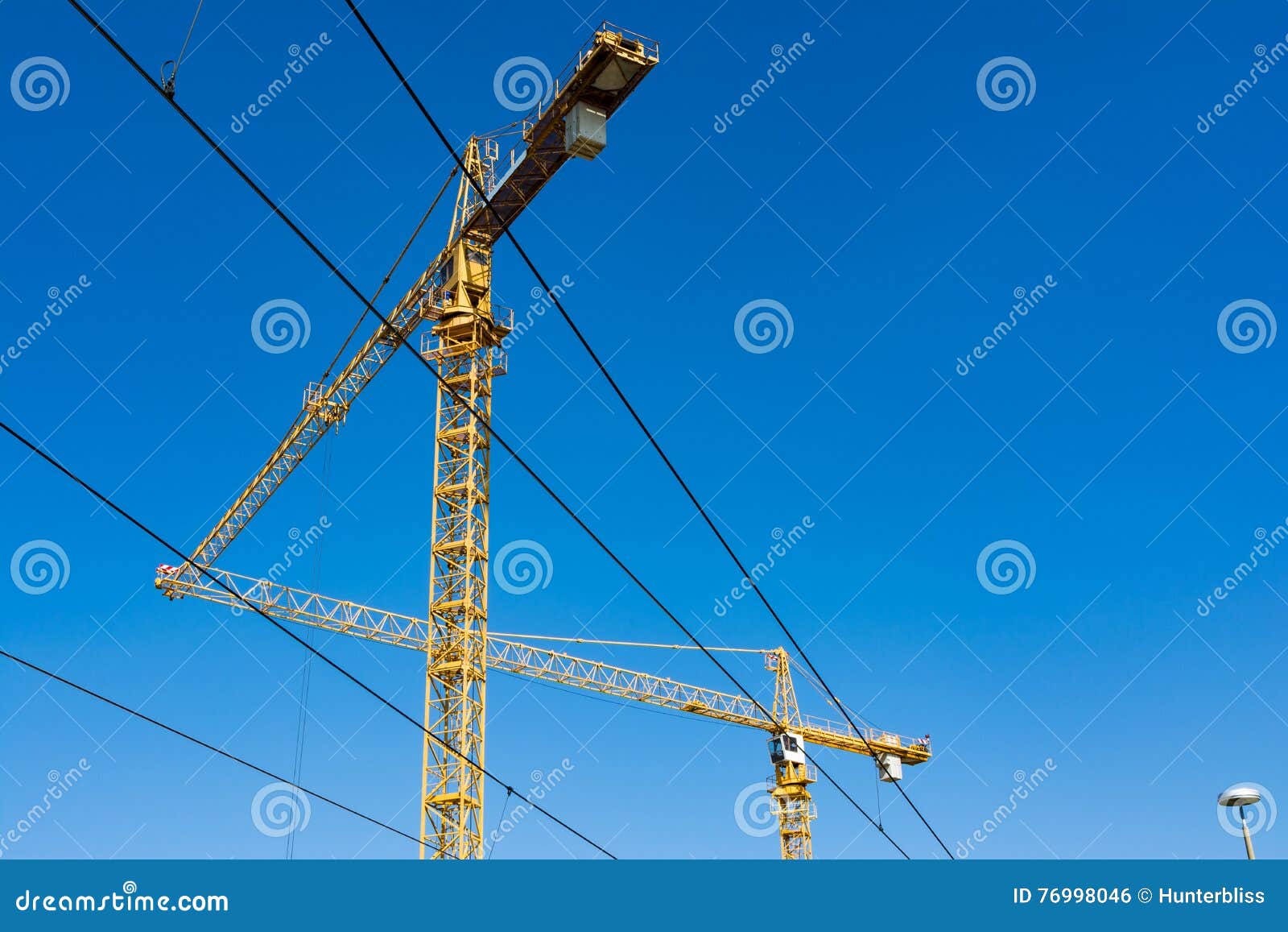 Two Cranes Pointed Toward Each Other Triangle Construction Stock Photo ...