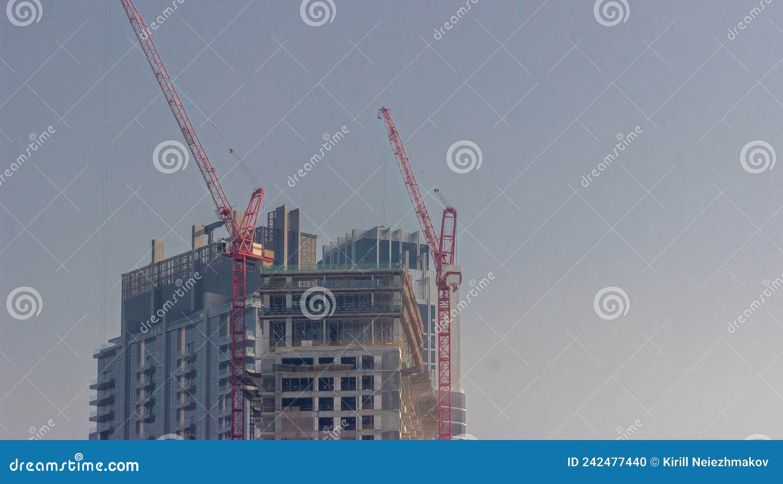 Two Cranes Working on Constraction Site Works of New Skyscraper ...