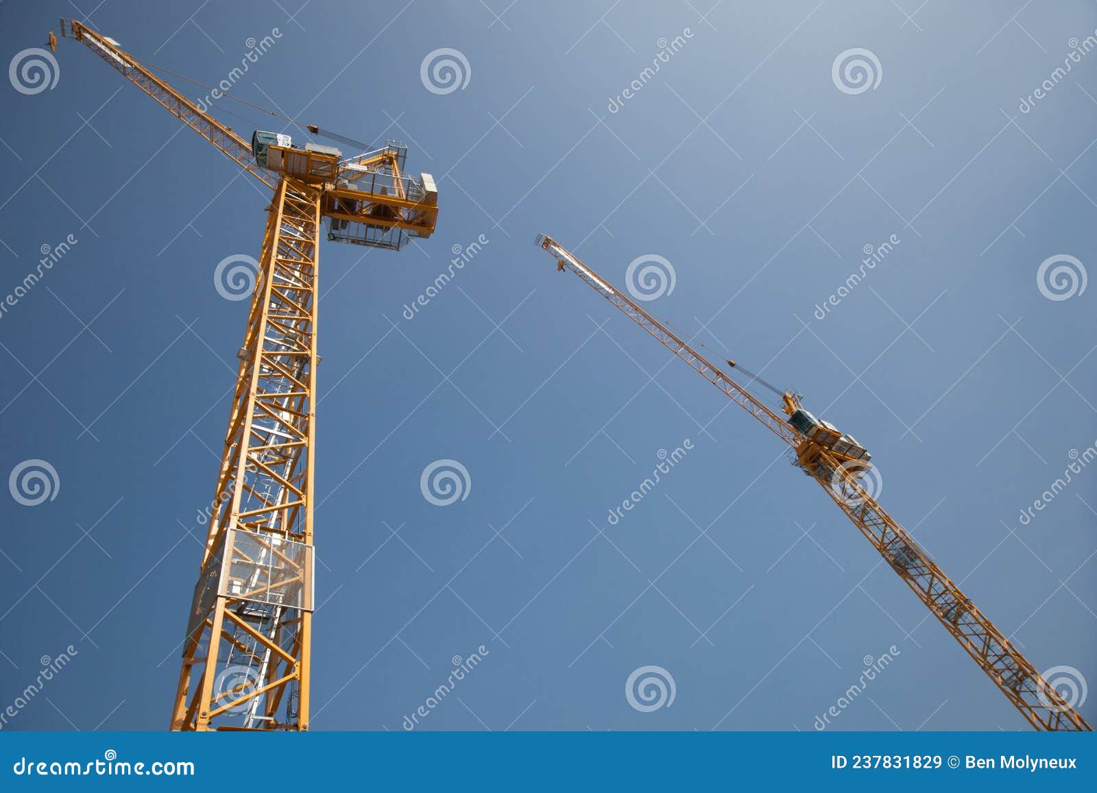 Two Cranes Working in Tandem on a Construction Site in the UK Editorial ...