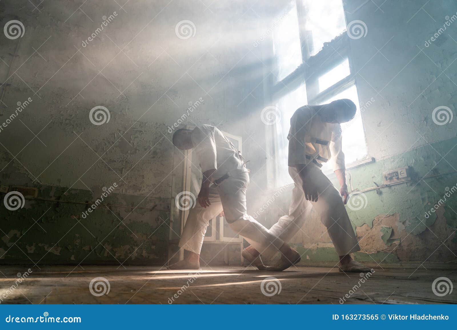 Two Crazy Men in Straitjackets are in an Abandoned Clinic Stock Image ...