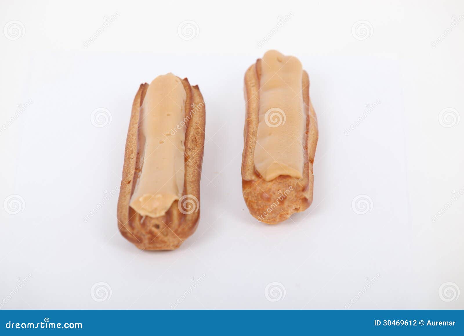 Two cream eclairs stock photo. Image of cream, gourmet - 30469612