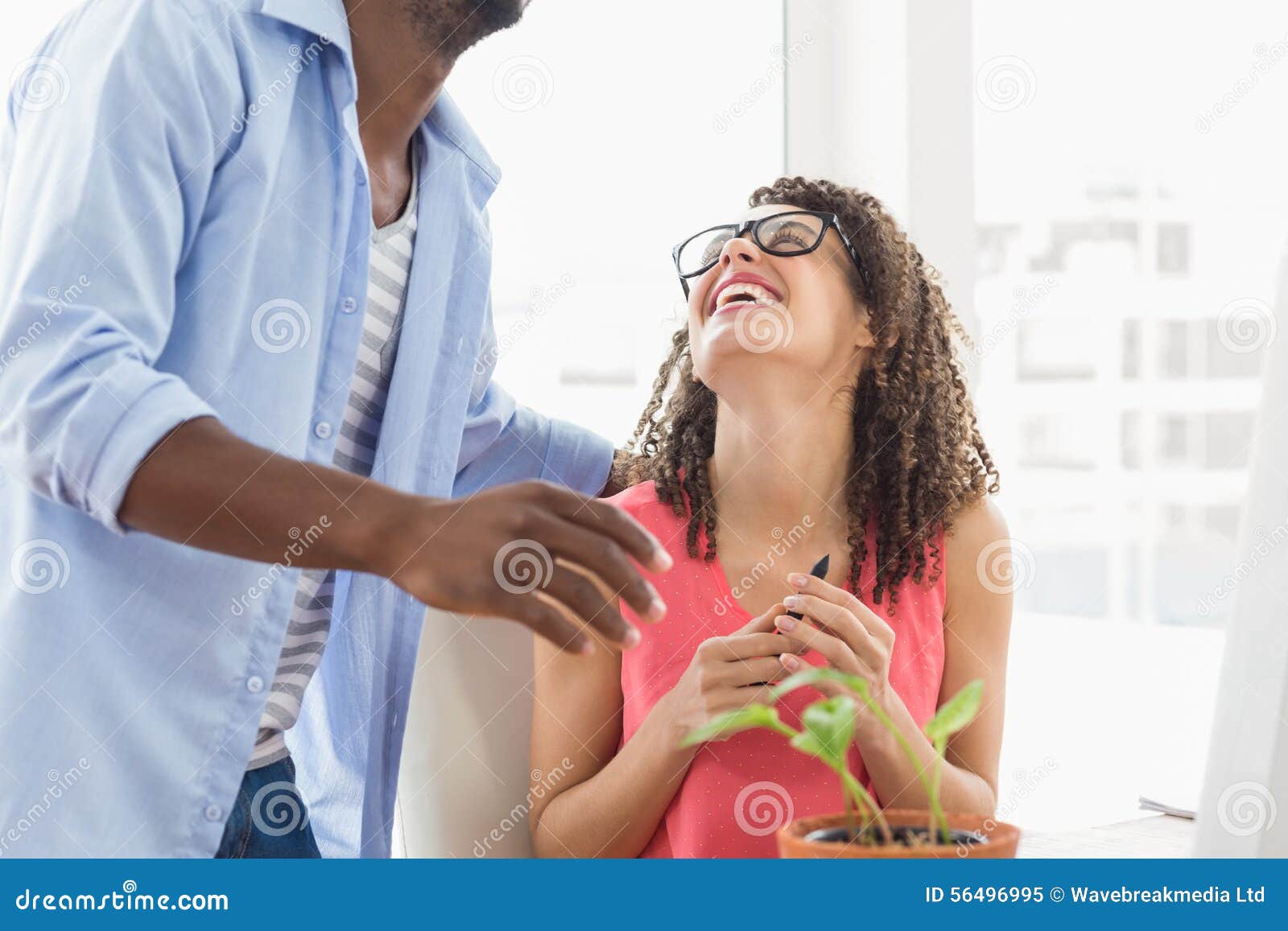 Two Creative Business Colleagues Laughing Together Stock Image - Image ...