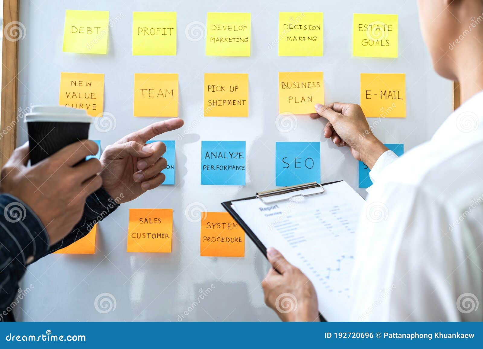 Two Creative Business People Meeting and Planning Use Post it Notes ...