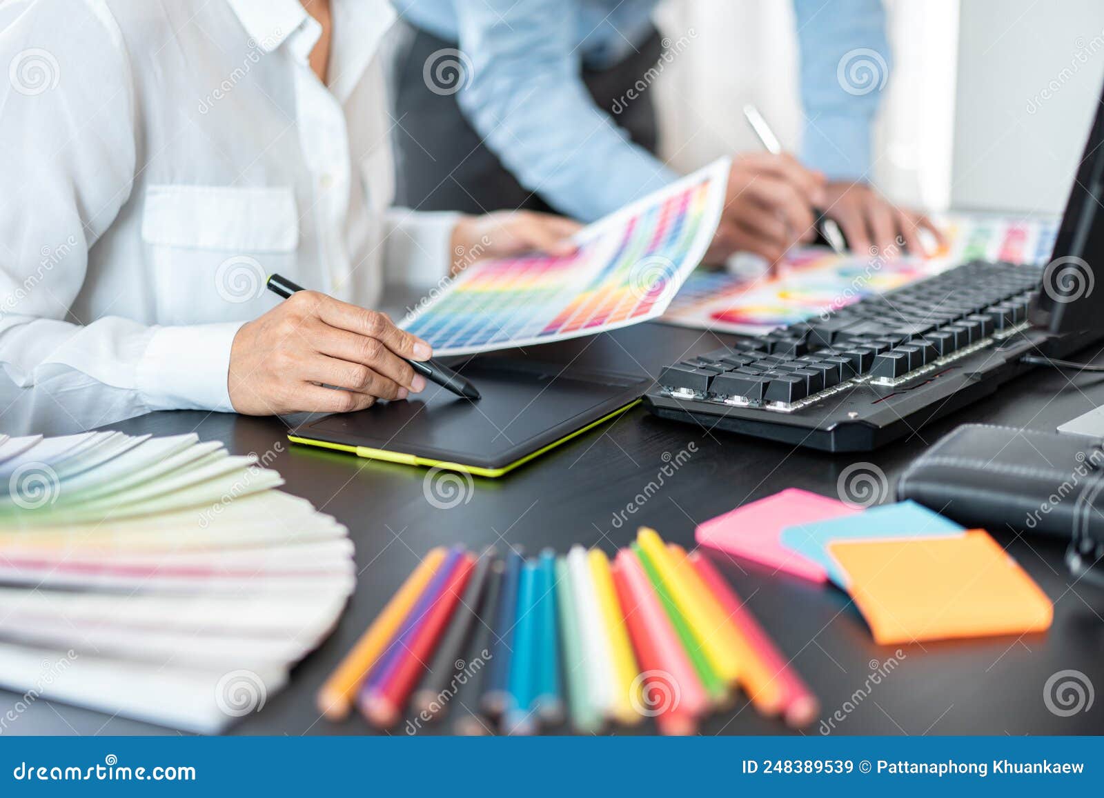 Two Creative Graphic Designer Team Working on Color Selection and ...
