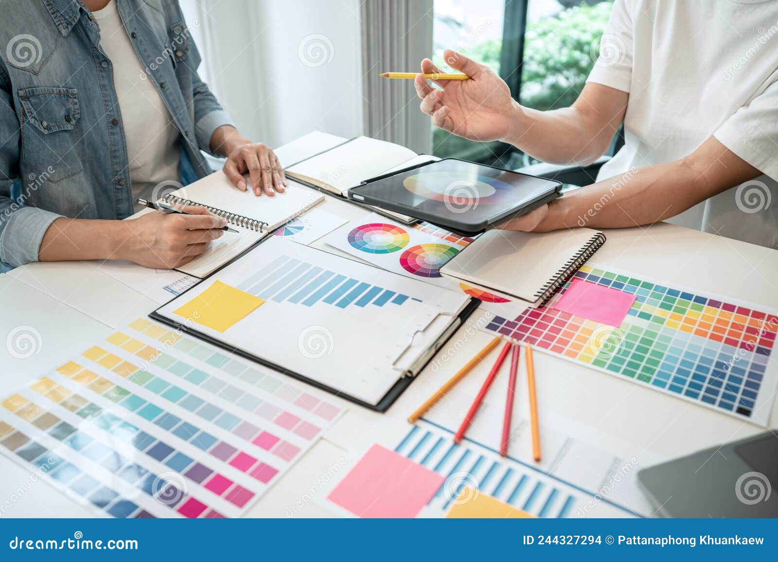Two Creative Graphic Designer Working on Color Selection and Drawing on ...