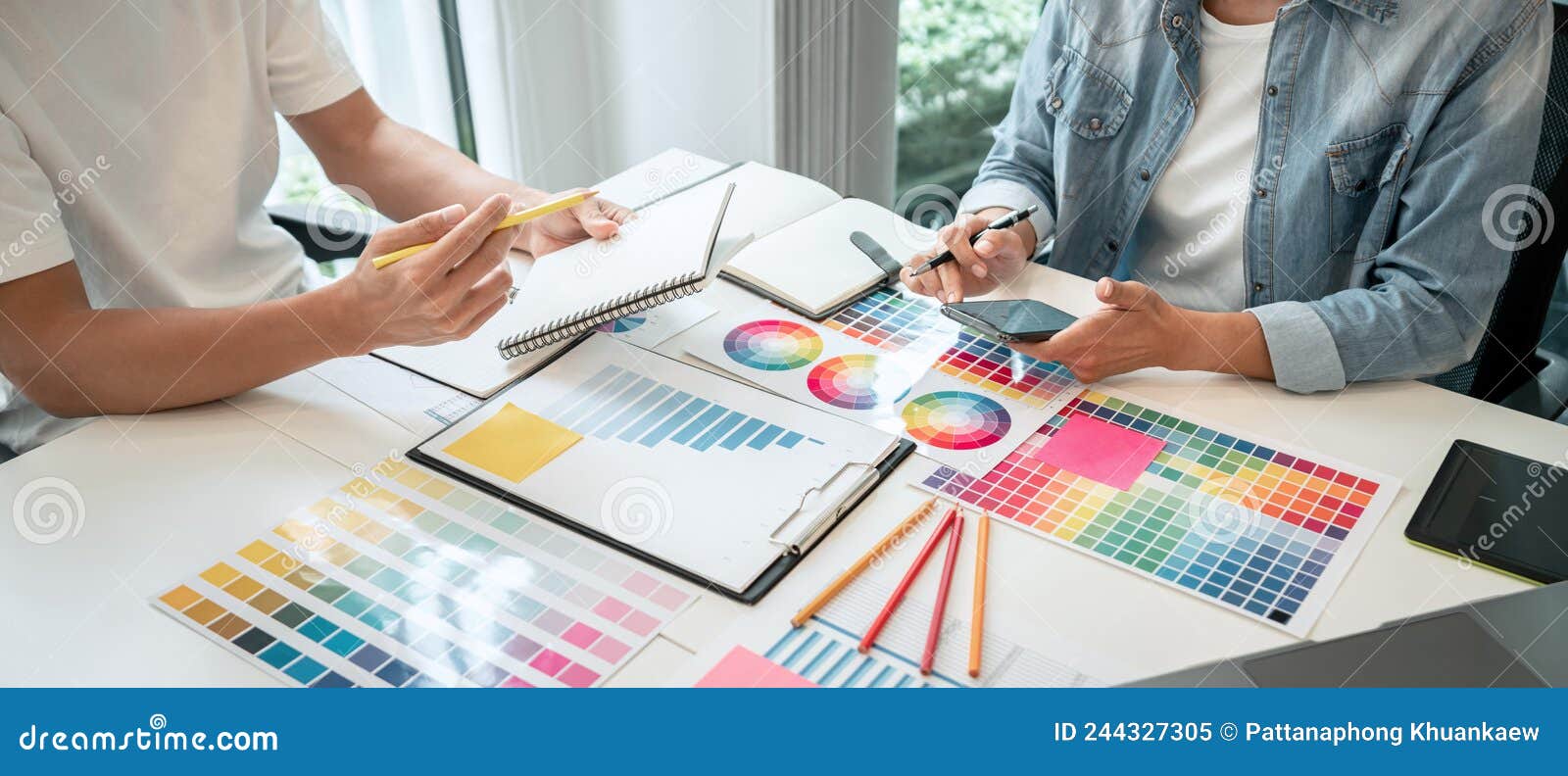 Two Creative Graphic Designer Working on Color Selection and Drawing on ...
